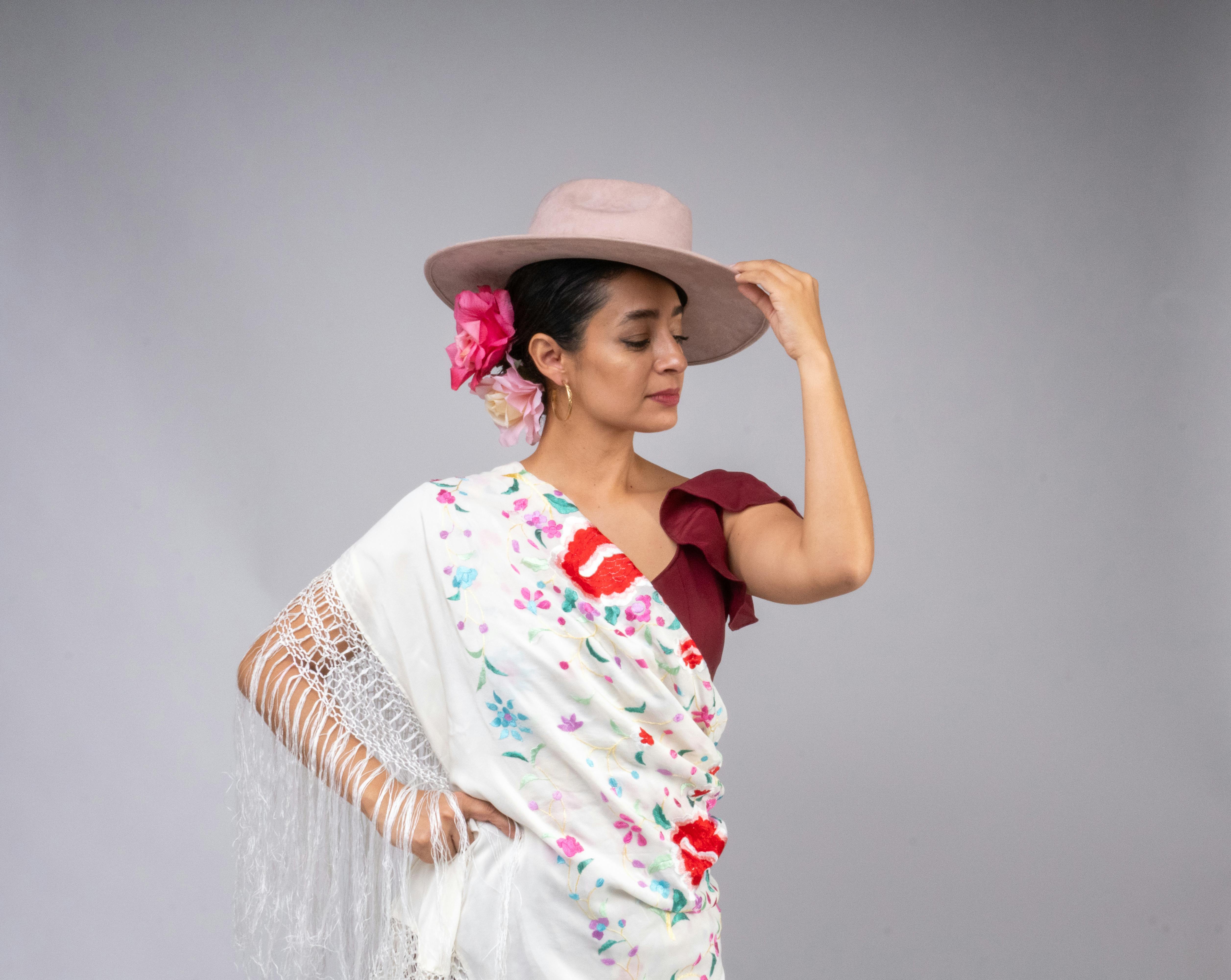 Elegant Hispanic Woman in Traditional Attire · Free Stock Photo