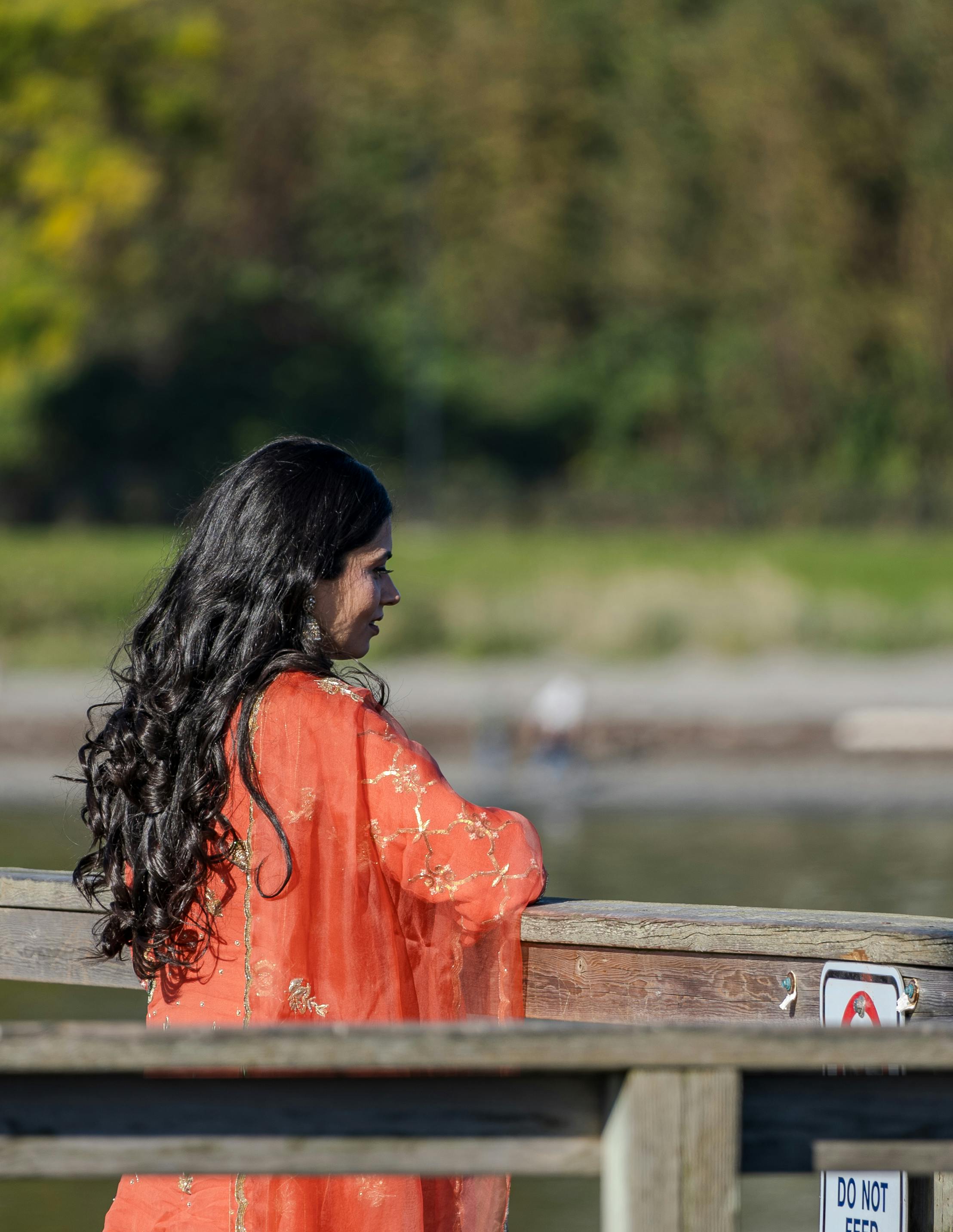 Elegant Woman in Orange Dress by White Rock Pier · Free Stock Photo