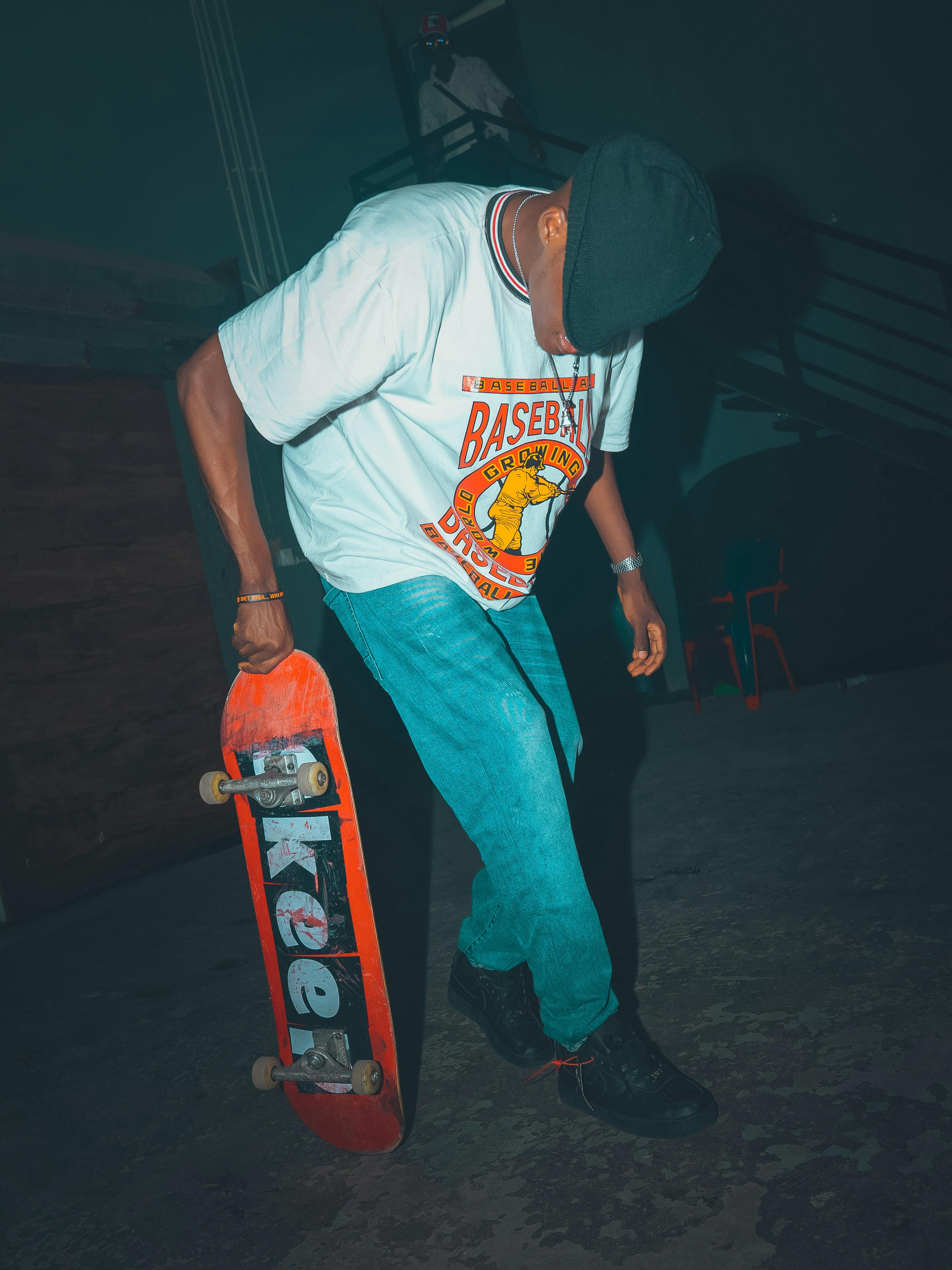 Urban Skater Preparing for Night Ride · Free Stock Photo