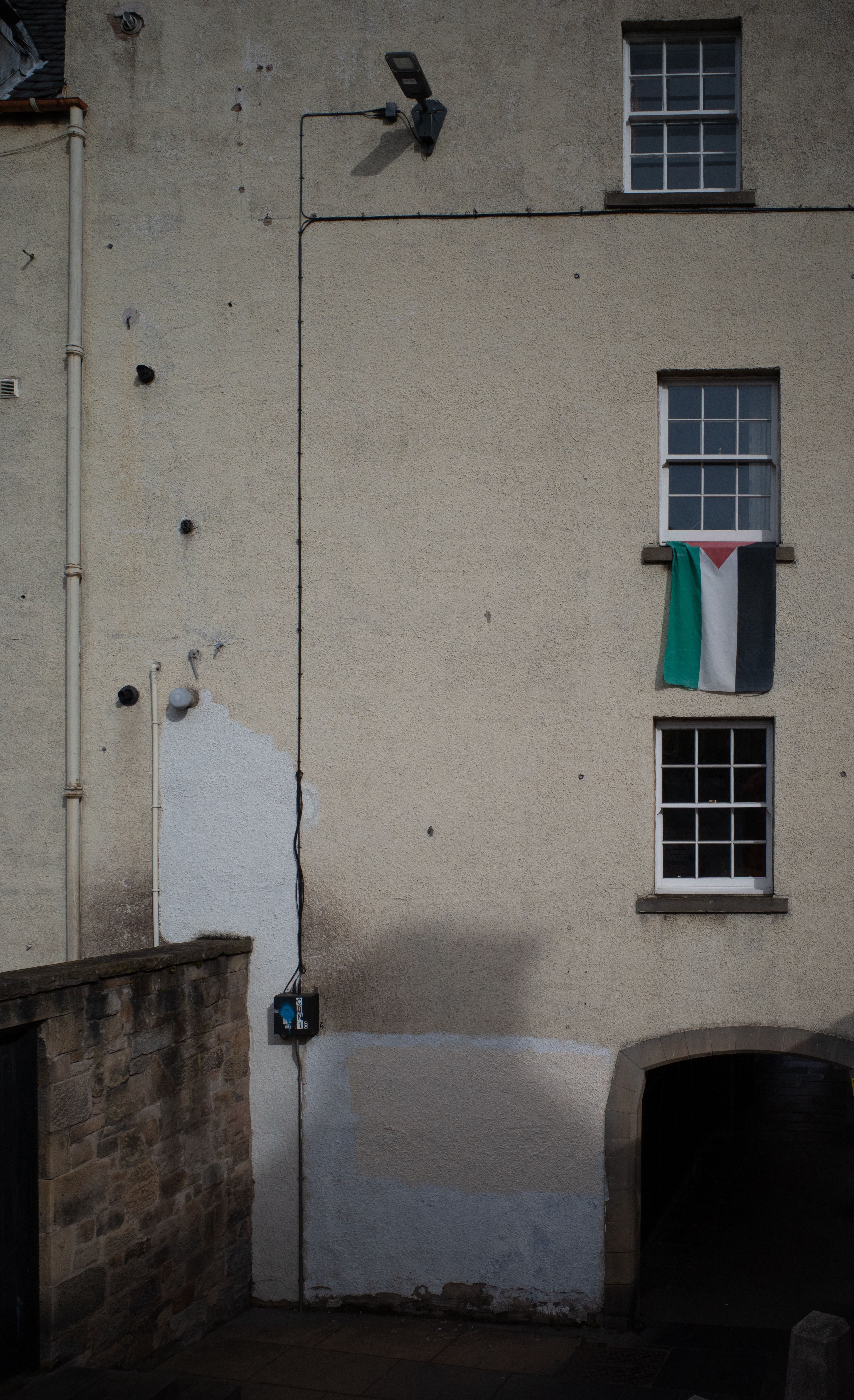 Urban Building Exterior with Flag on Window · Free Stock Photo