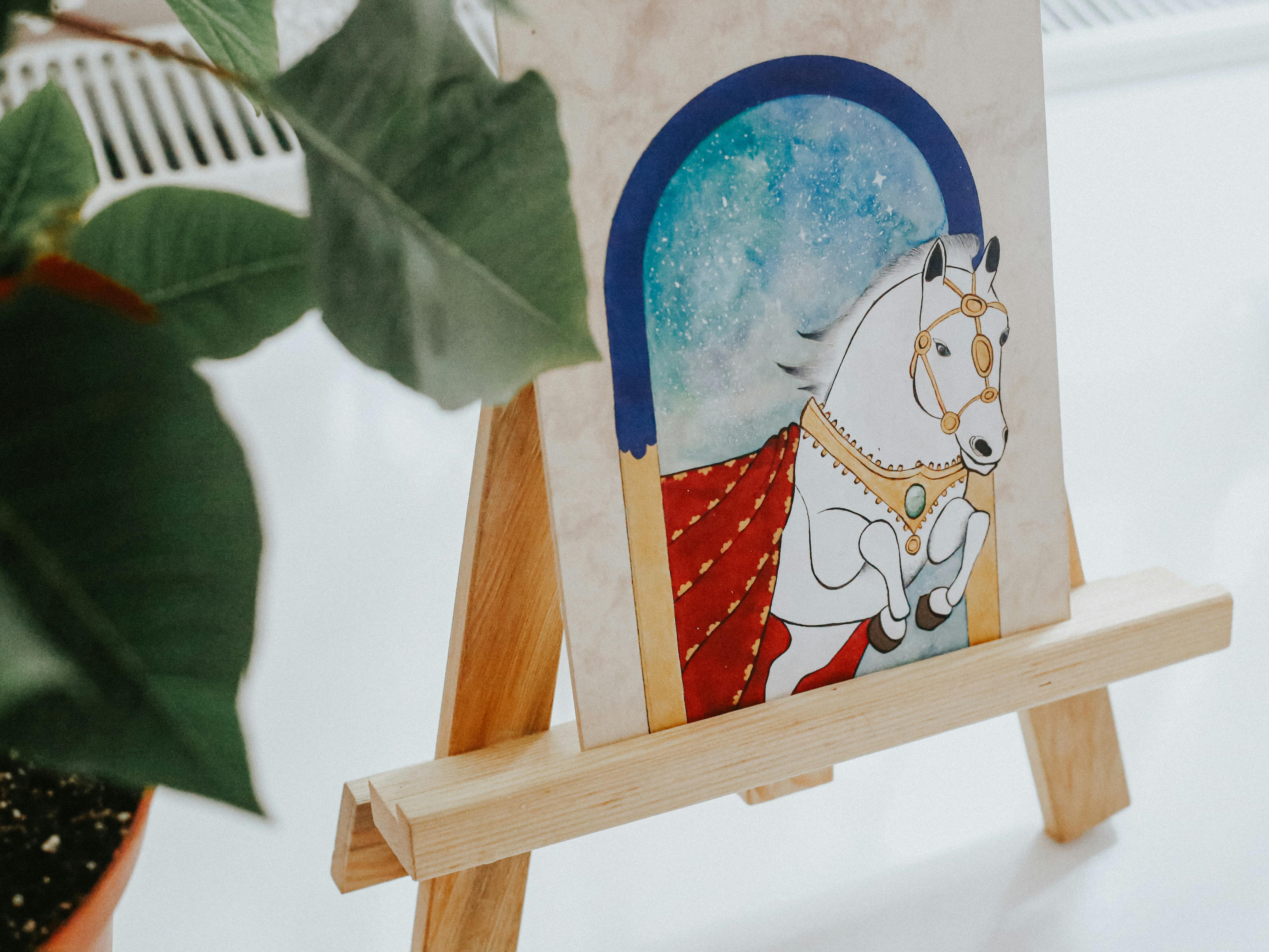 Colorful Illustration on Easel with Plant · Free Stock Photo