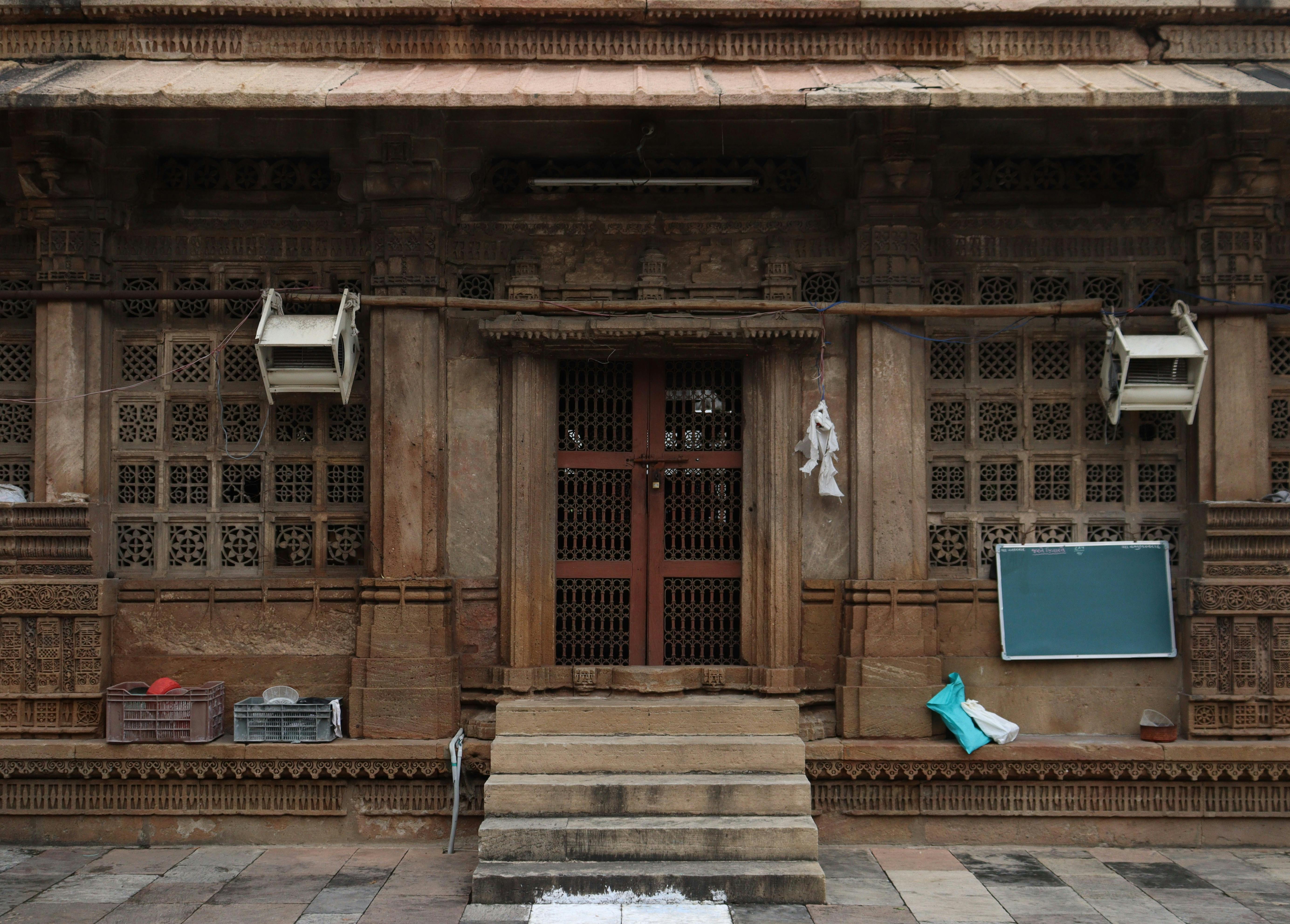 Ancient Stone Structure with Ornate Carvings · Free Stock Photo