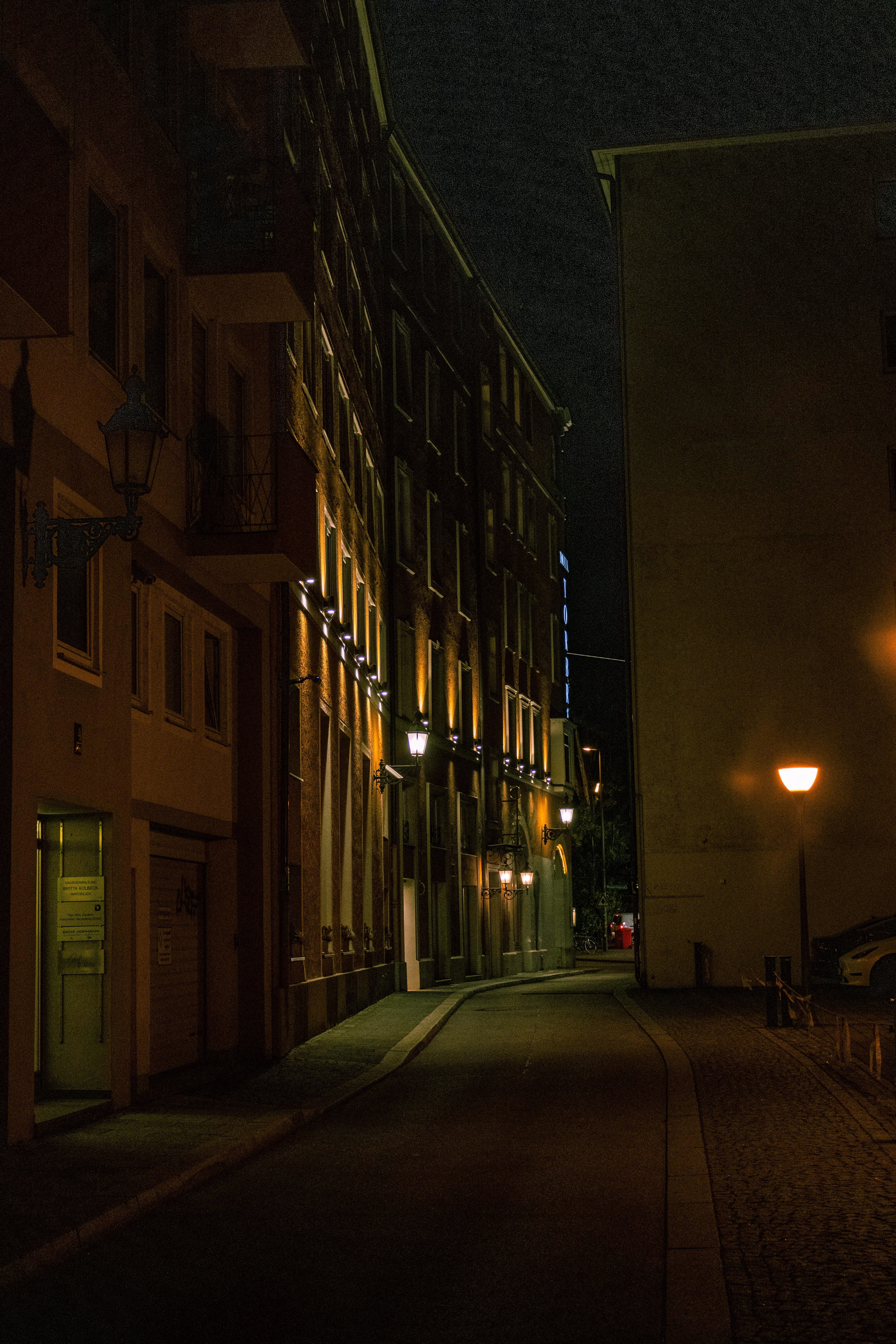 Serene Urban Street at Night with Soft Illumination · Free Stock Photo