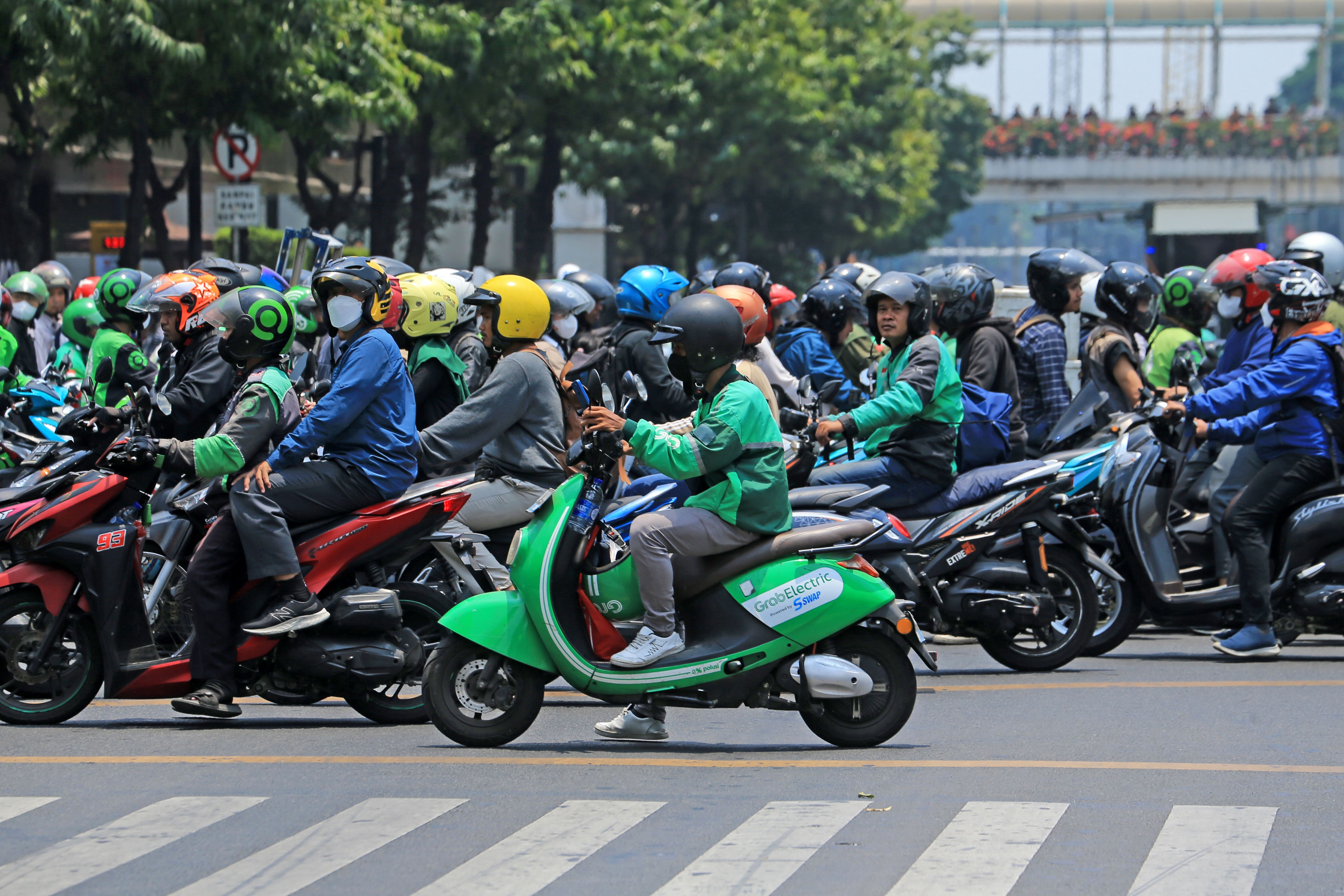 Busy Urban Street with Motorcycle Riders · Free Stock Photo