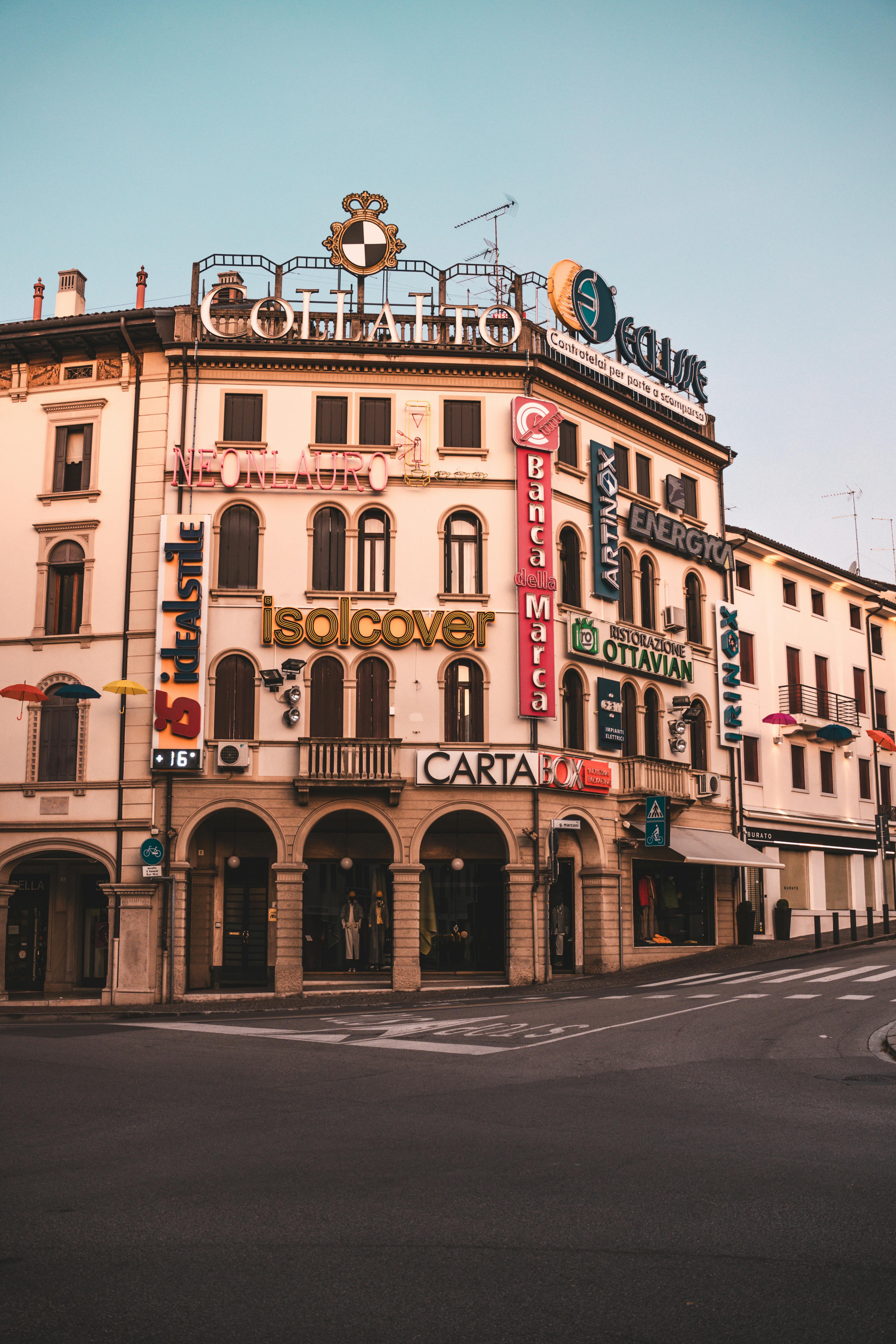 Historic European Building with Colorful Signage · Free Stock Photo