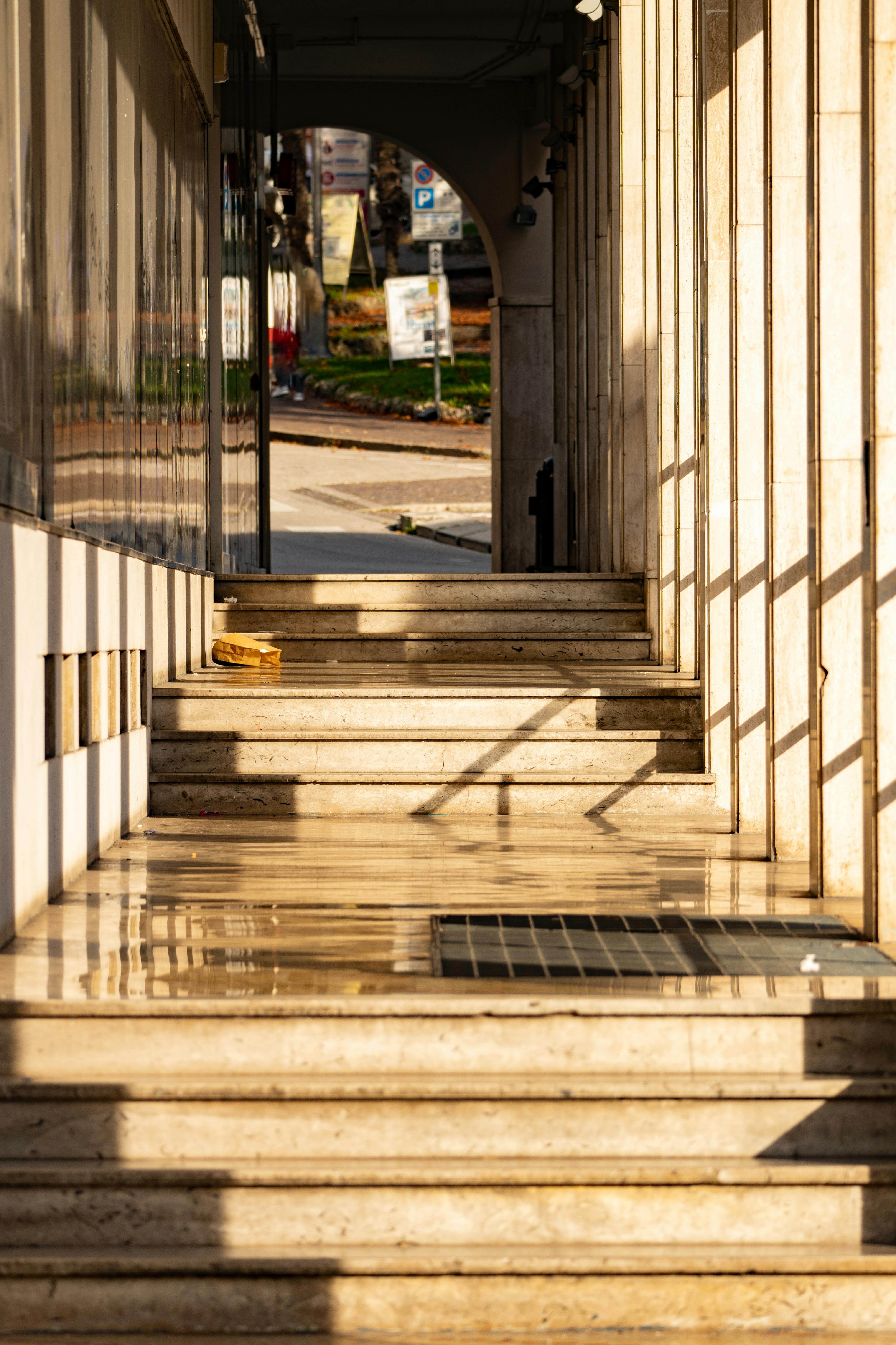 Sunlit Urban Passage with Stone Steps · Free Stock Photo