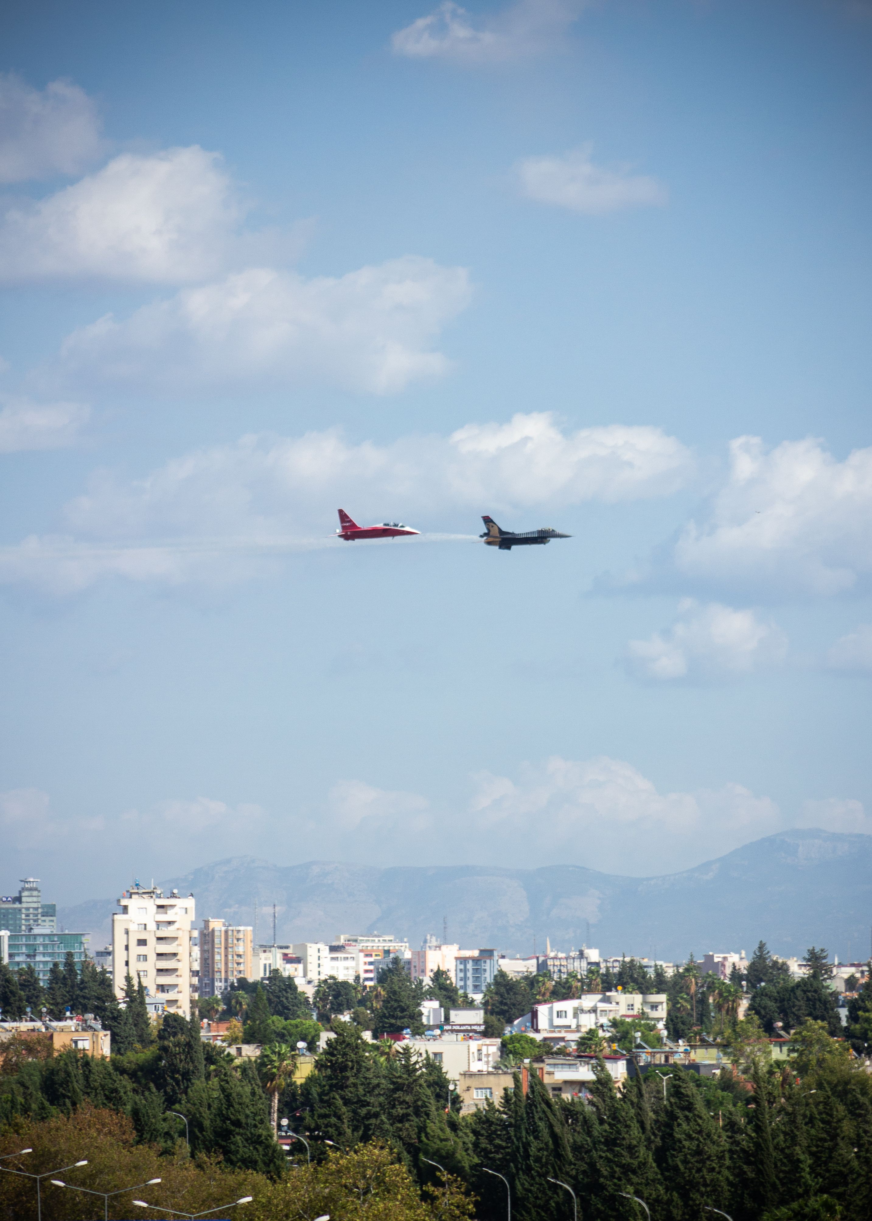 Military Jets Flying Over Urban Cityscape · Free Stock Photo