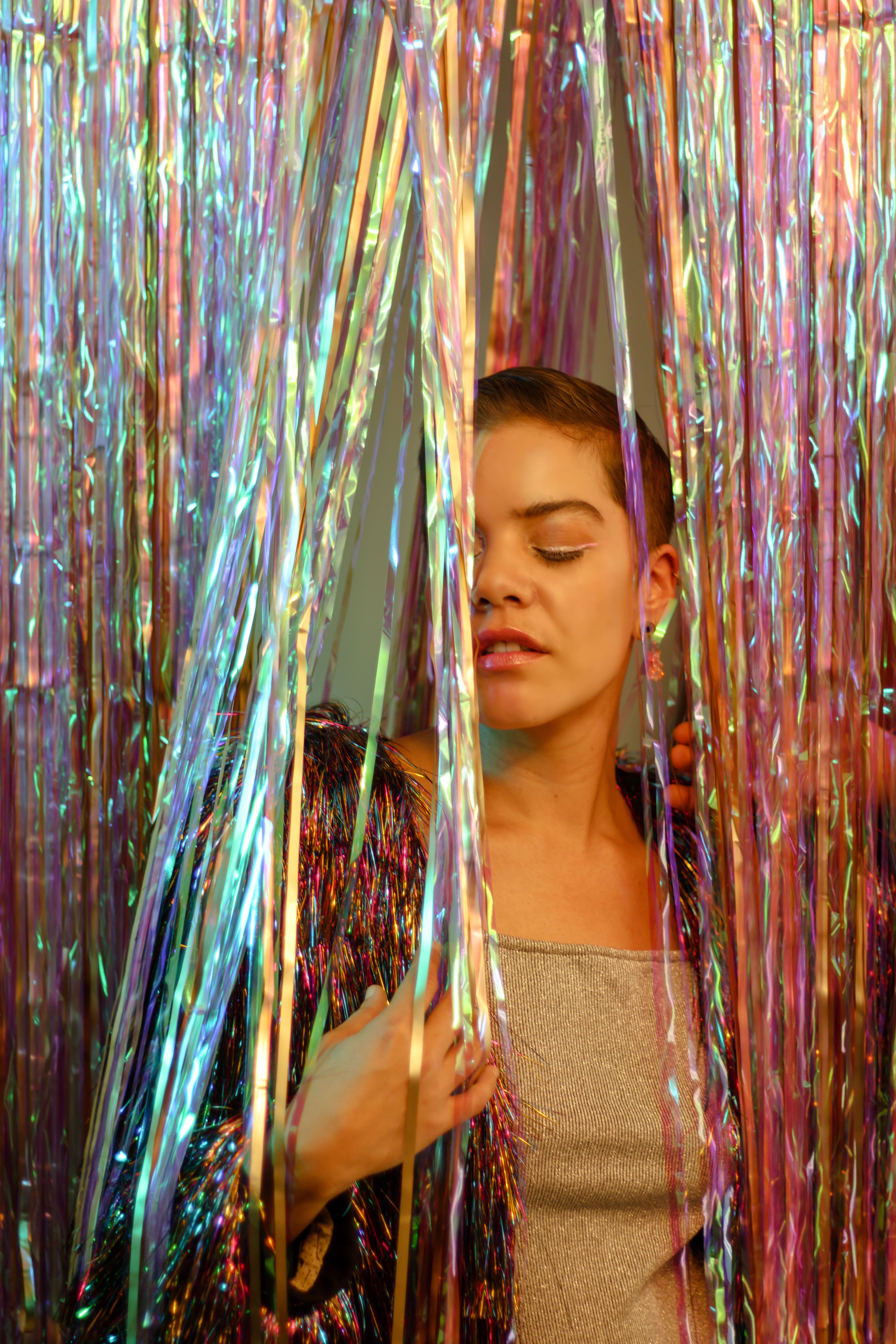 Elegant Woman Posing with Colorful Tinsel in CDMX · Free Stock Photo