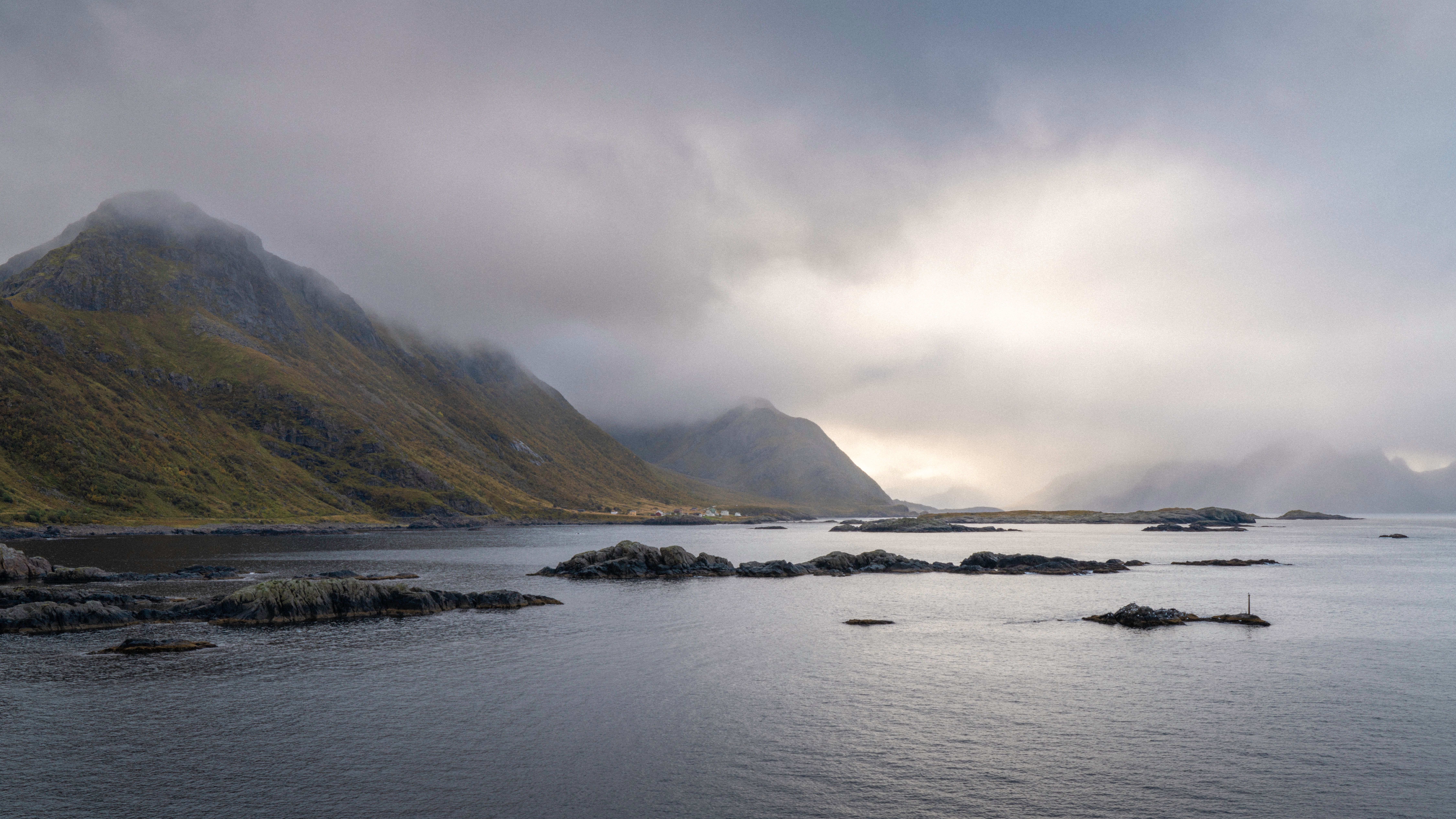 Dramatic Norwegian Fjord Landscape Under Cloudy Sky · Free Stock Photo