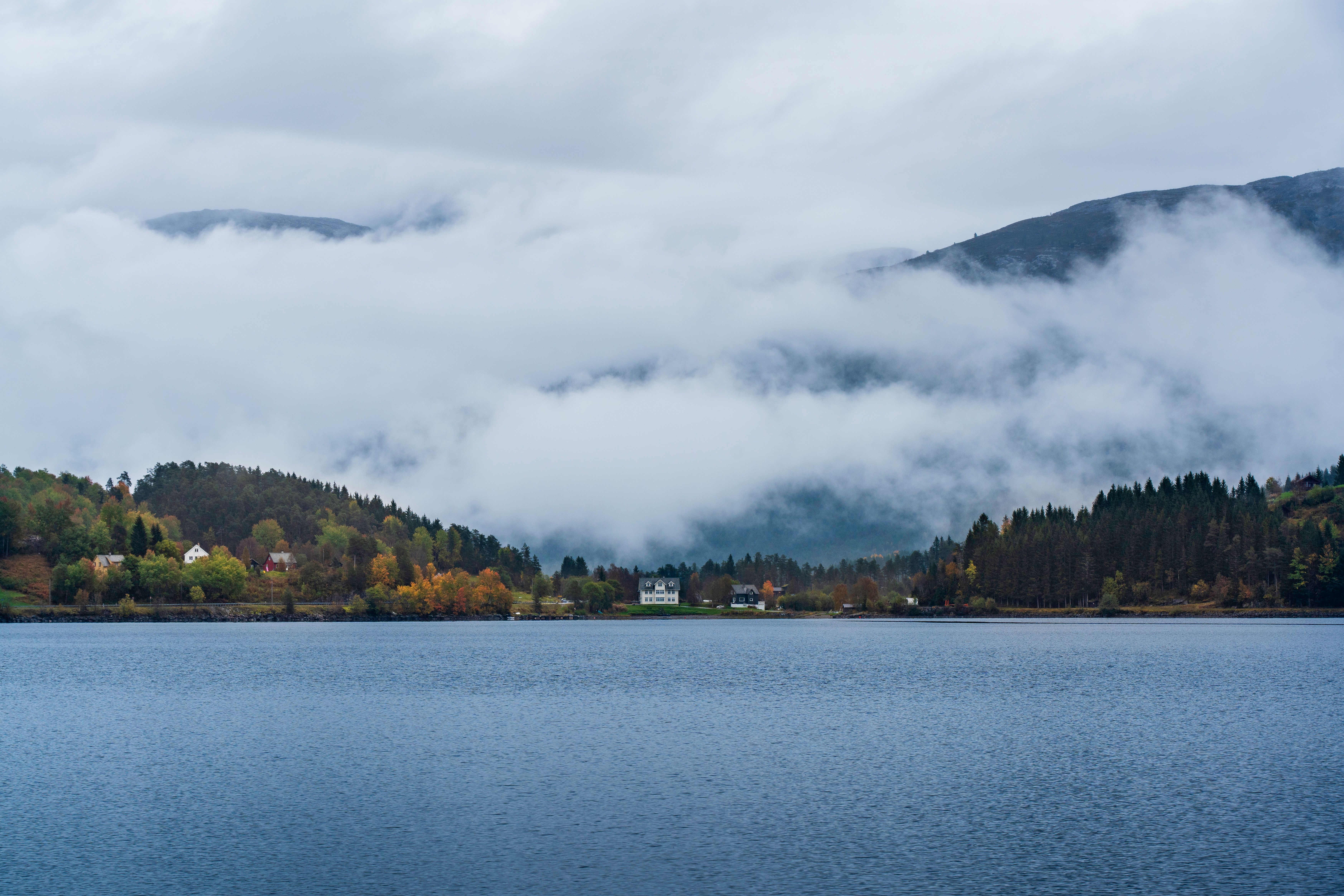 Cloudy Autumn Lake in Scenic Norwegian Landscape · Free Stock Photo