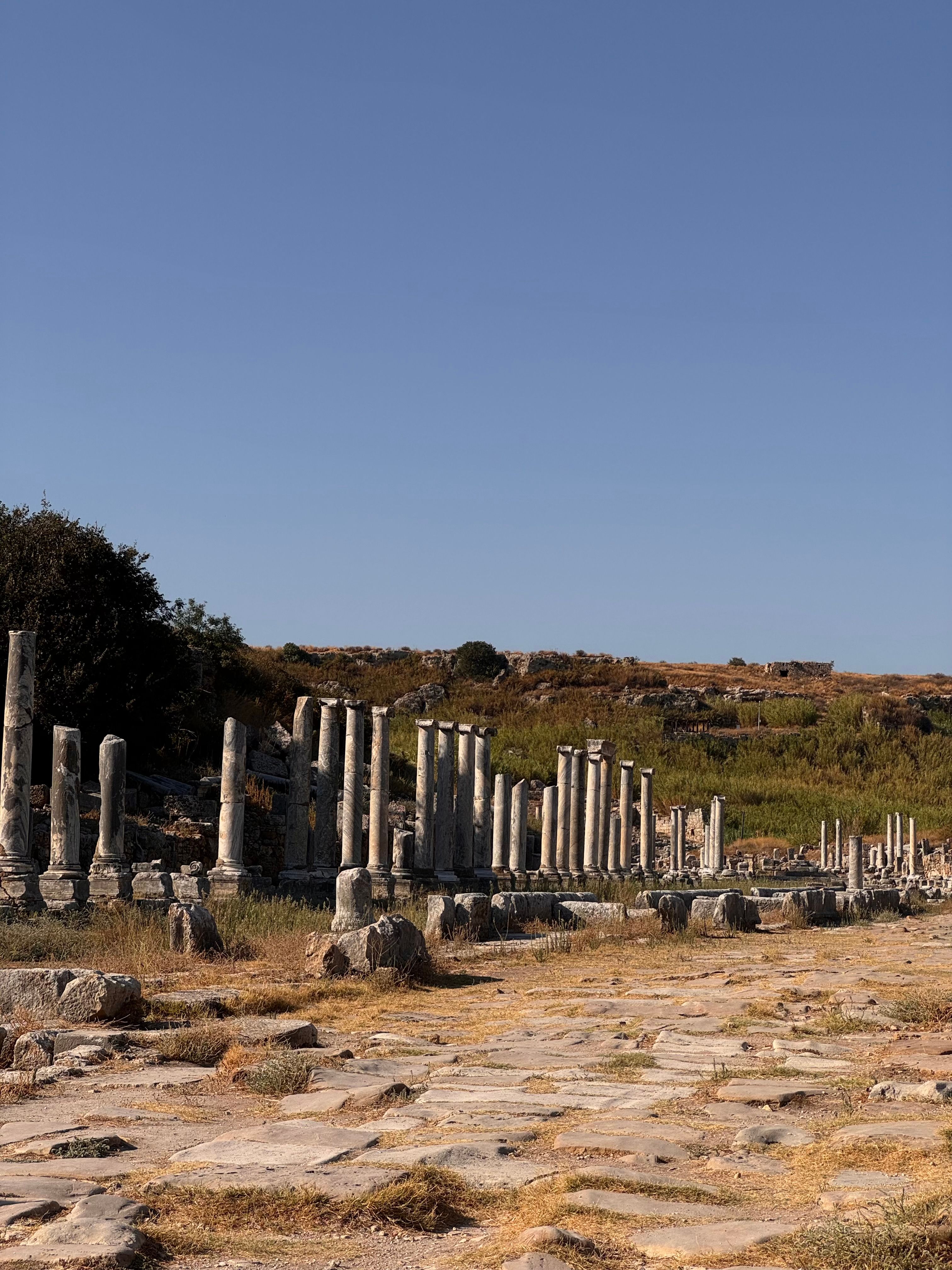 Ancient Ruins with Stone Columns Under Blue Sky · Free Stock Photo