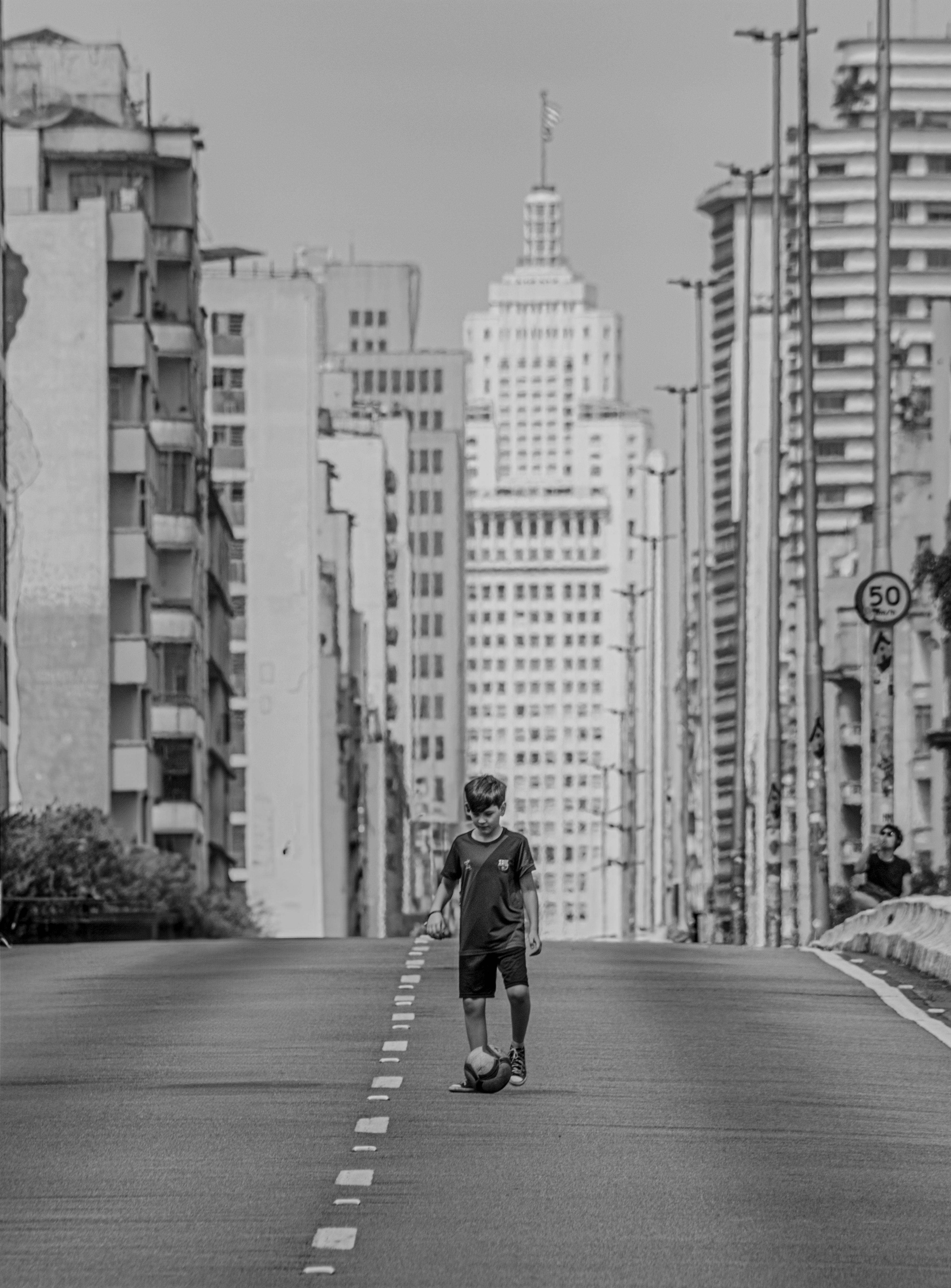 Lonely Boy Playing Soccer in a City Street · Free Stock Photo