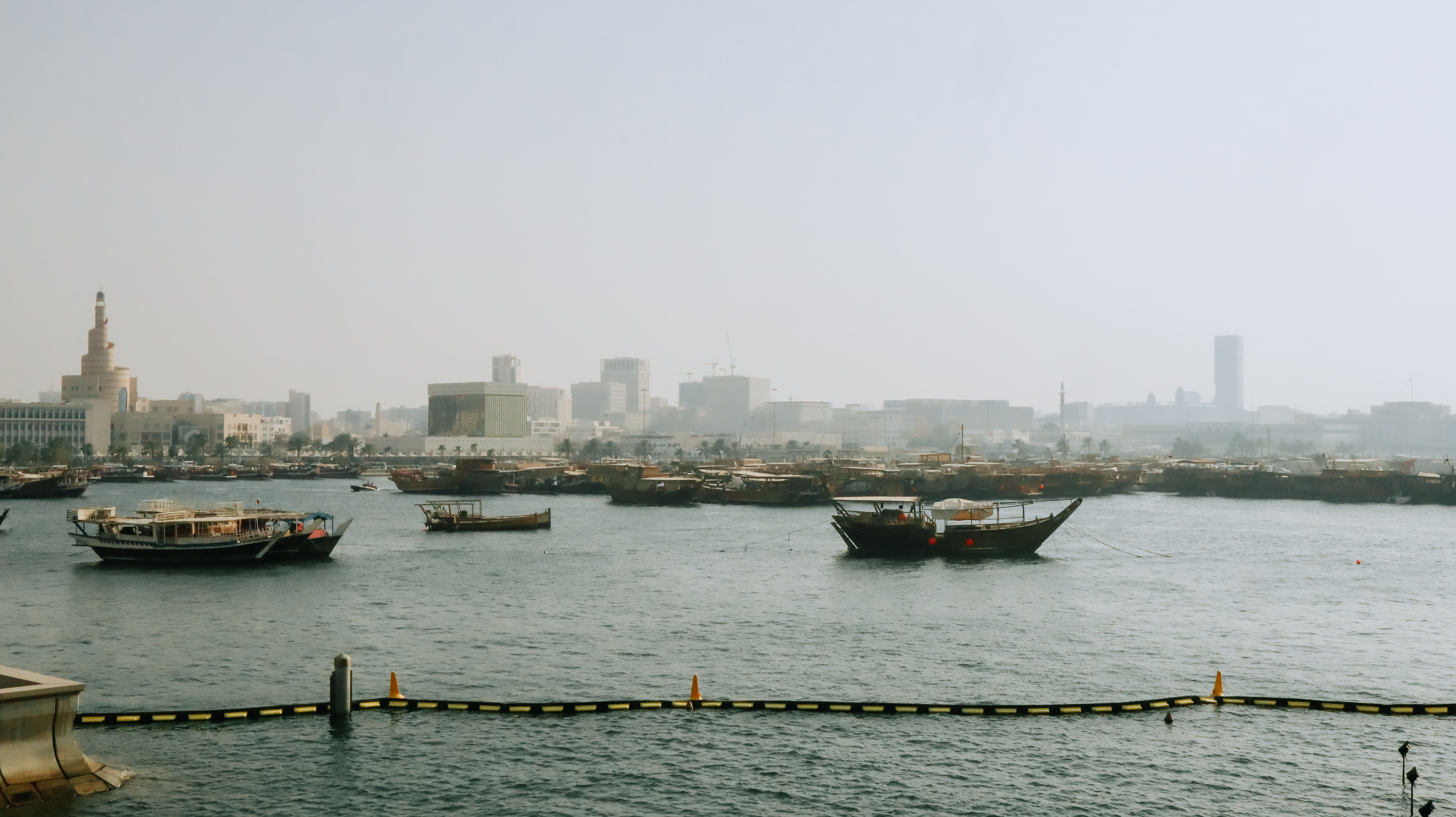 Traditional Wooden Boats on Doha's Waterfront · Free Stock Photo