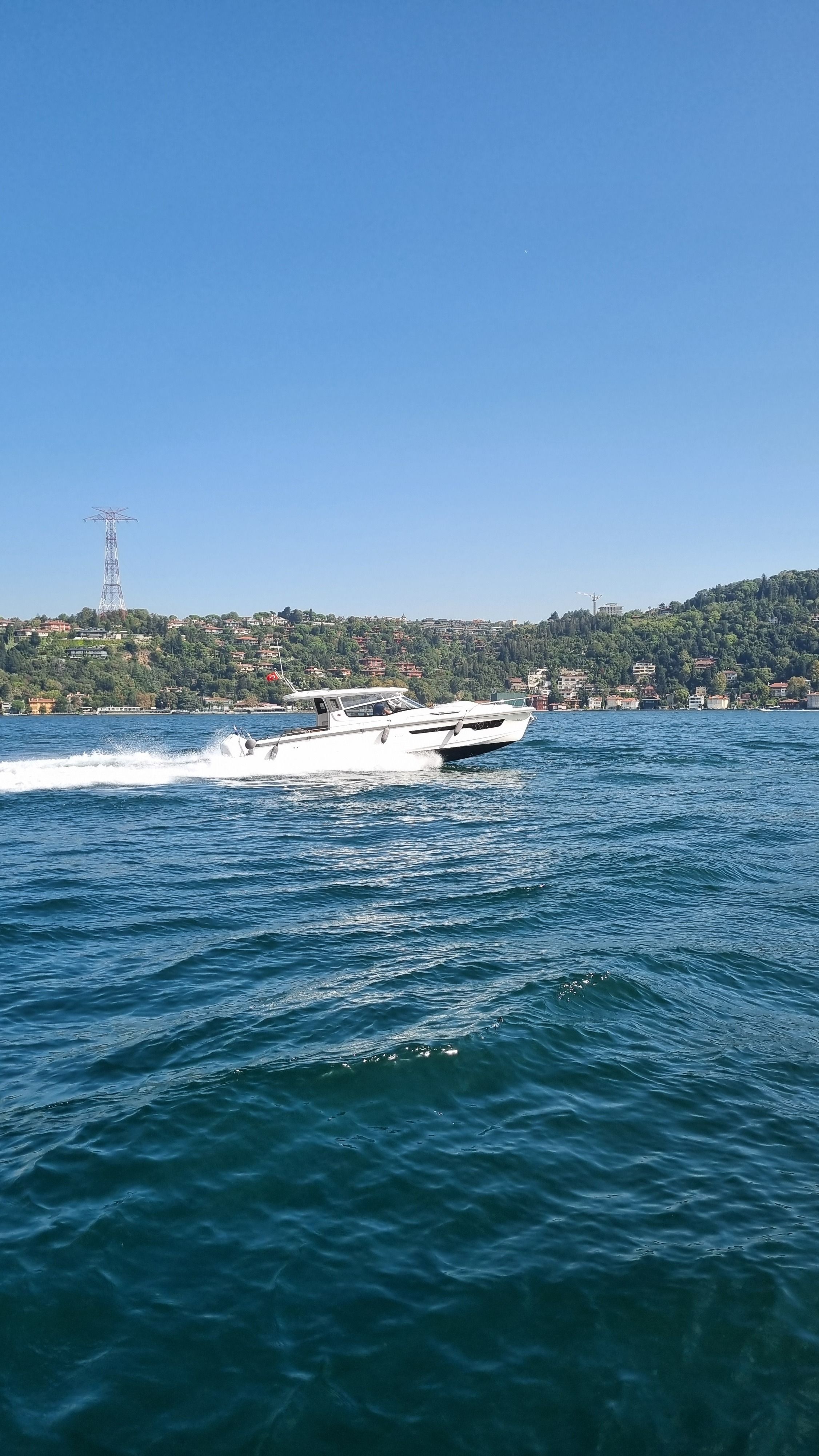 Luxury Yacht Cruising on Blue Sea Waters · Free Stock Photo