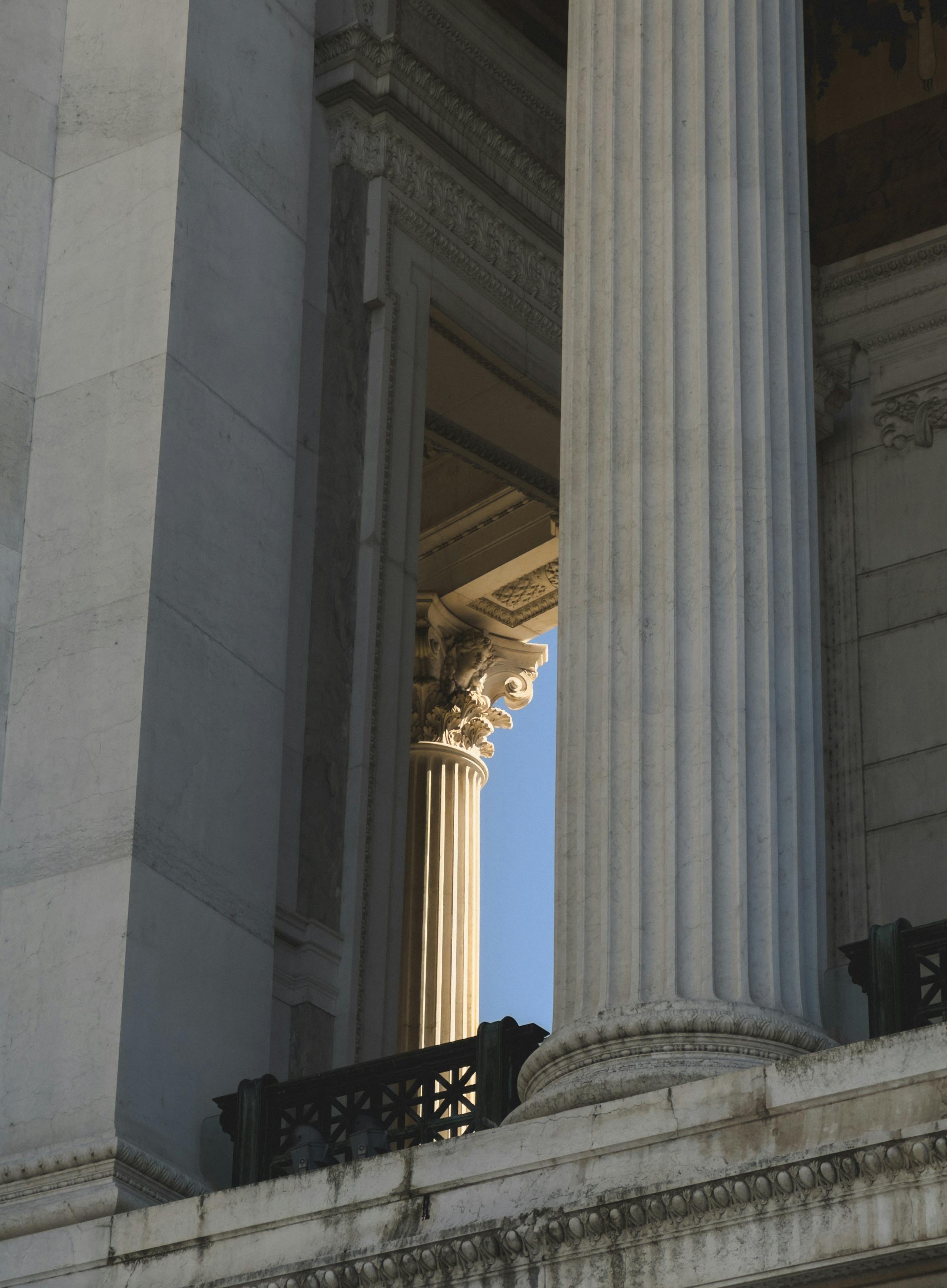 Majestic Neoclassical Columns with Sky View · Free Stock Photo