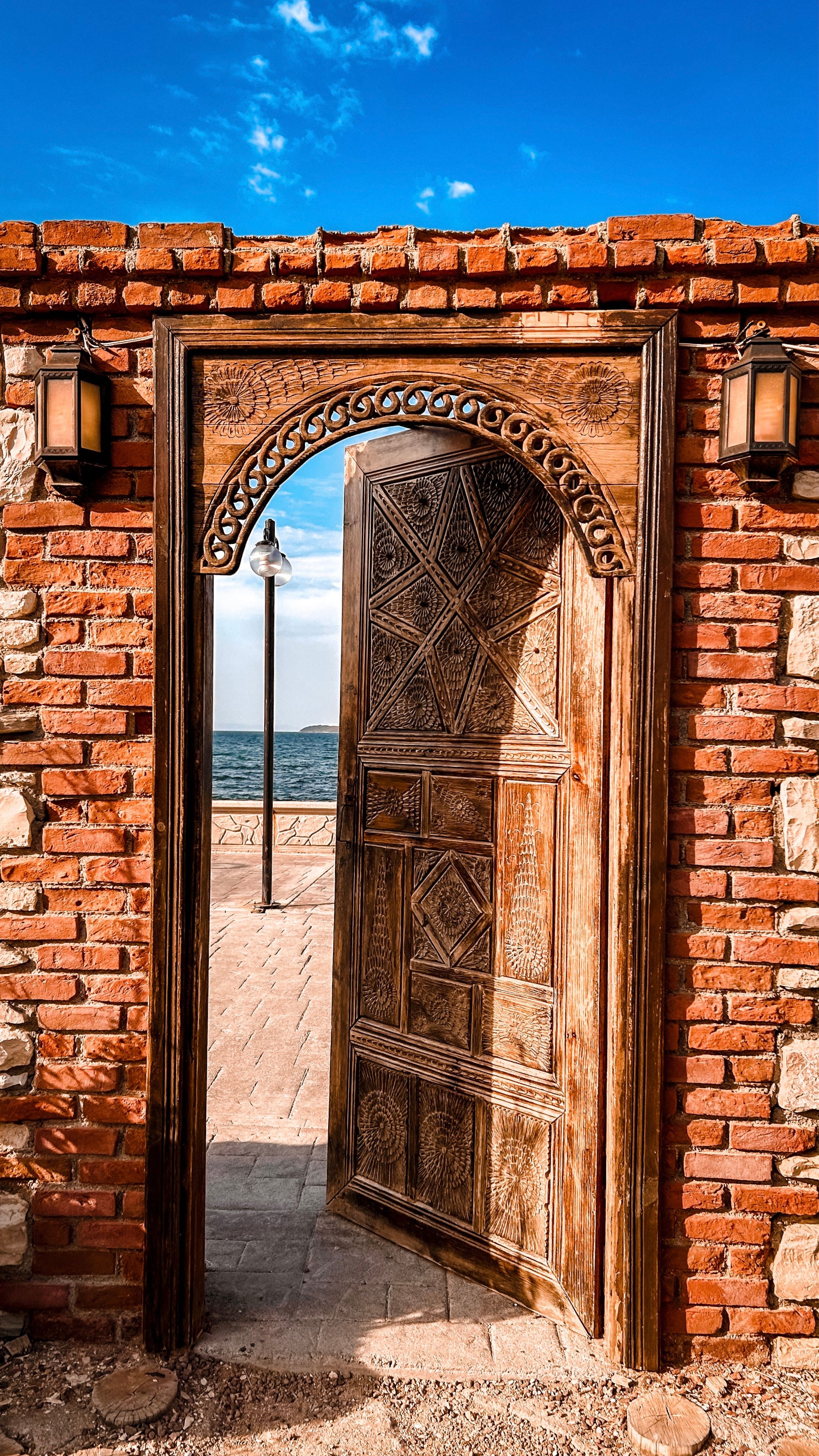 Rustic Wooden Doorway Leading to Ocean View · Free Stock Photo