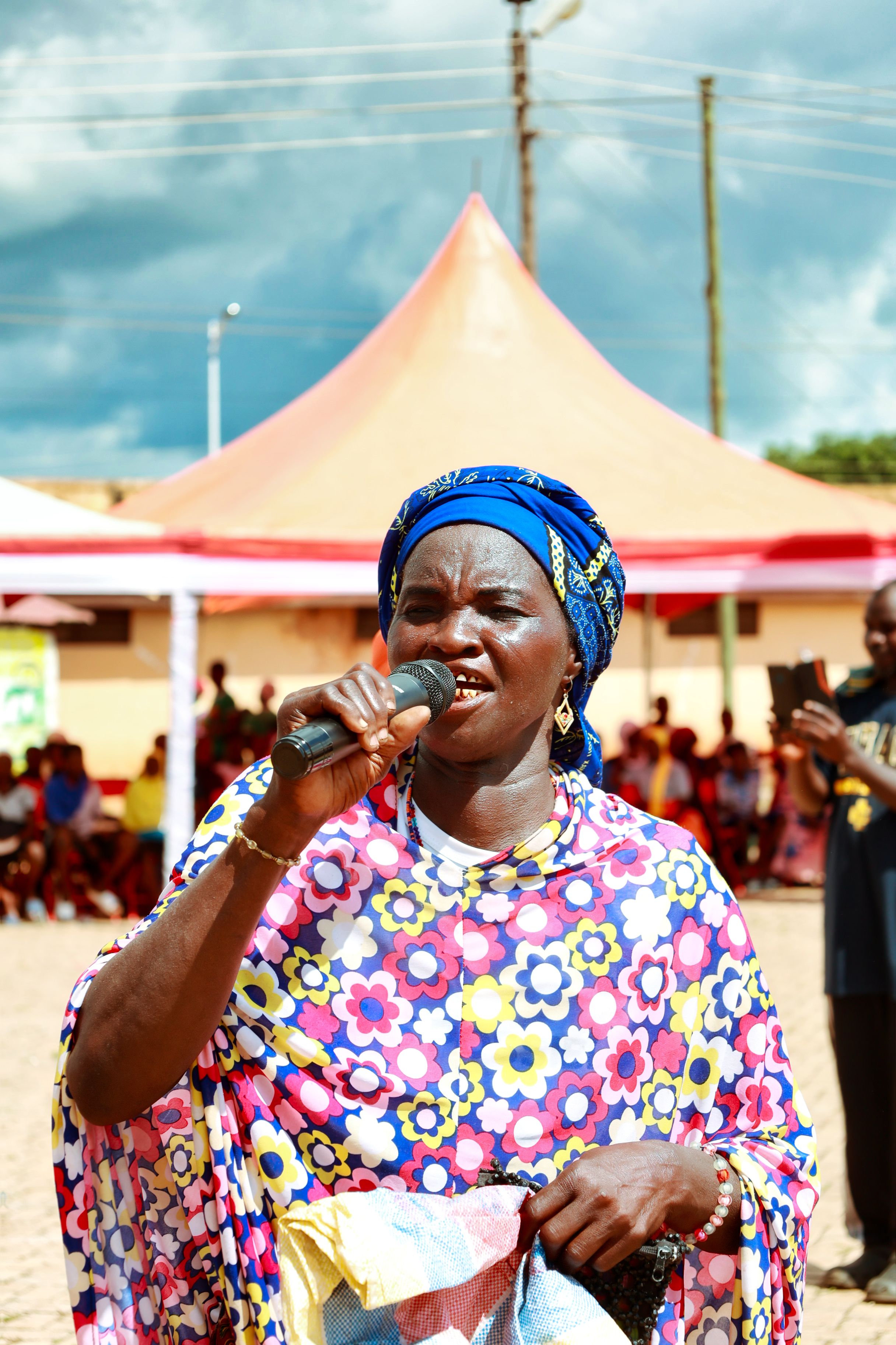 African Woman Singing in Colorful Traditional Dress Outdoors · Free ...