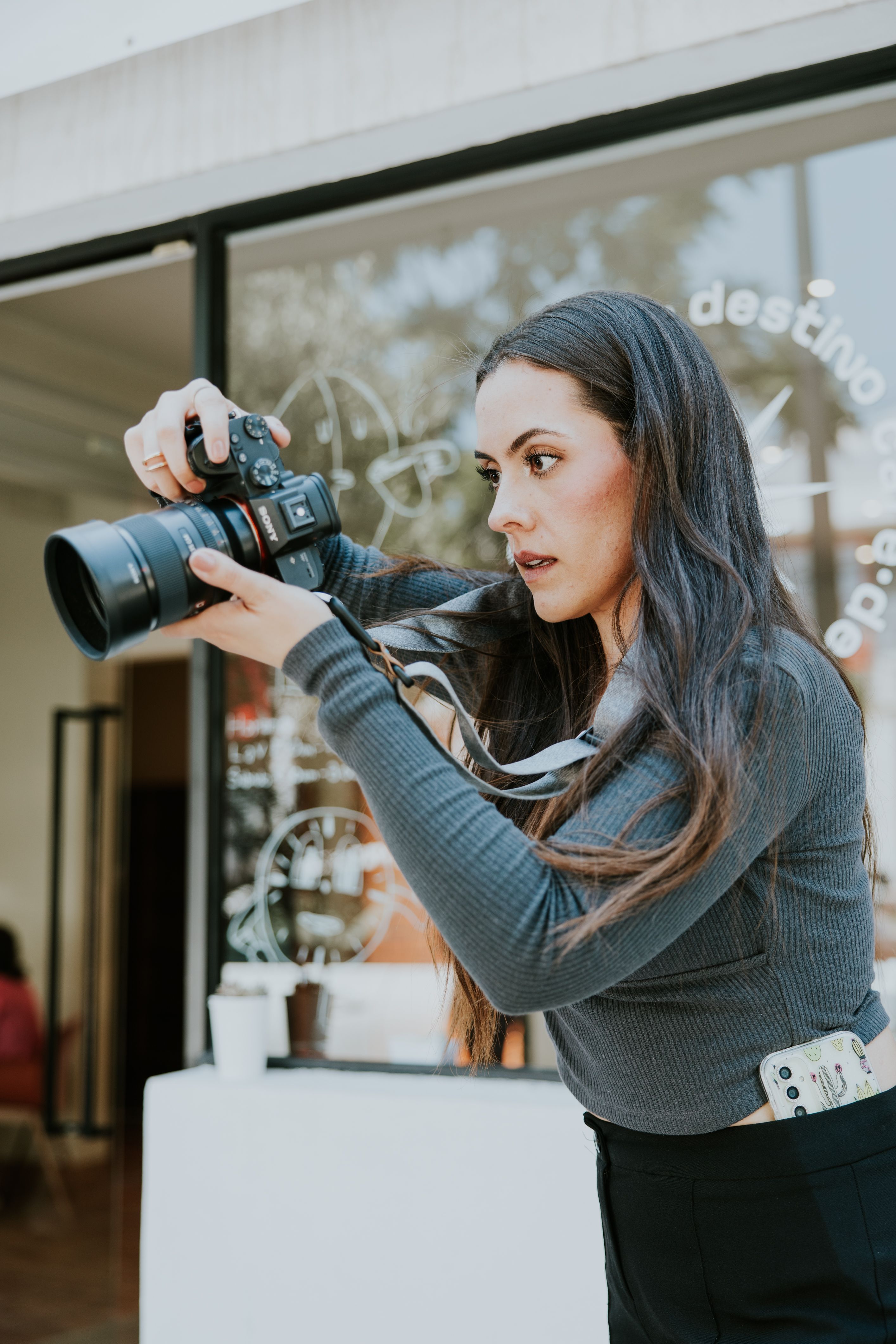 Professional Photographer Shooting at Cafe · Free Stock Photo