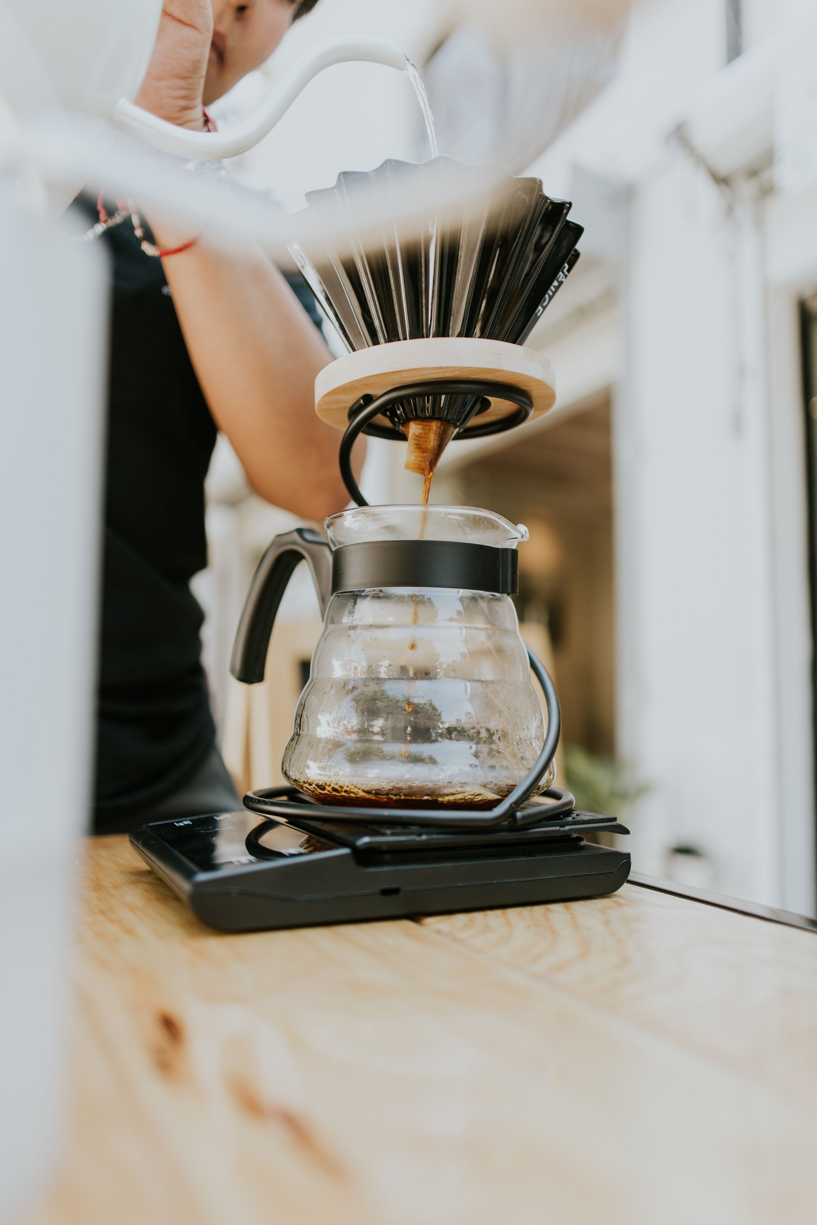 Pour Over Coffee Brewing in Cafe Setting · Free Stock Photo