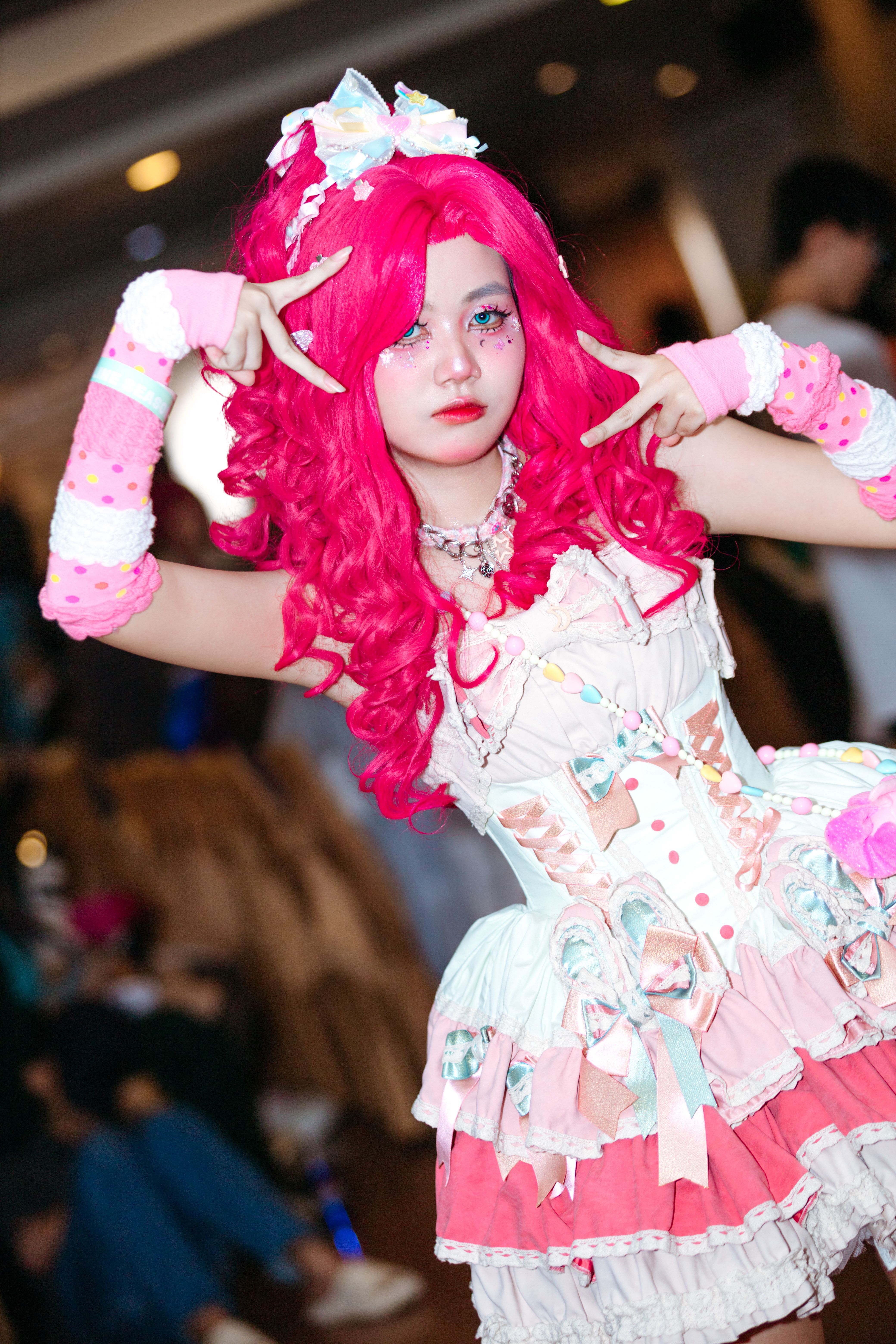 Cosplayer in Pink Dress with Vibrant Hair Posing · Free Stock Photo