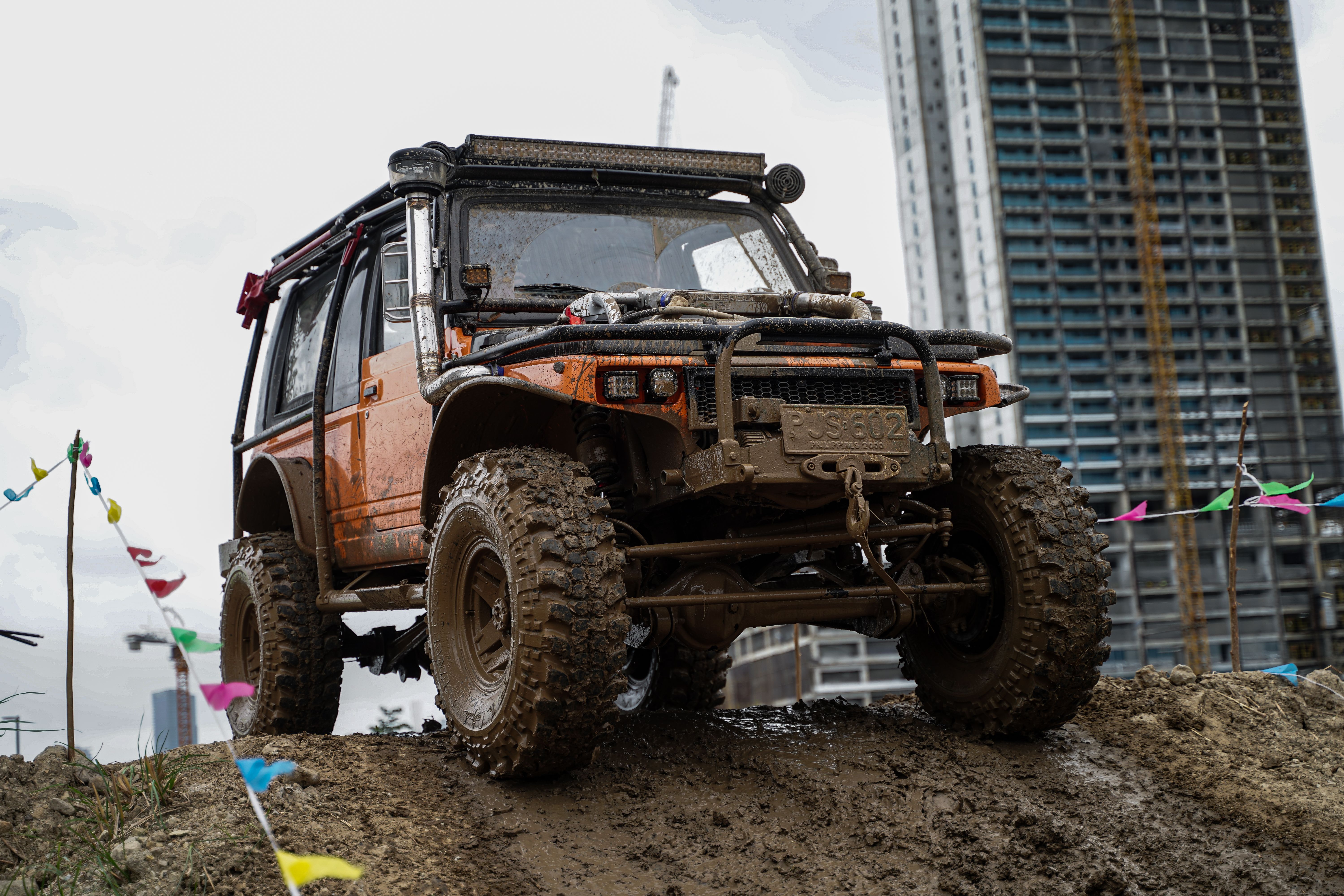 Off-road Vehicle on Muddy Terrain in Urban Area · Free Stock Photo