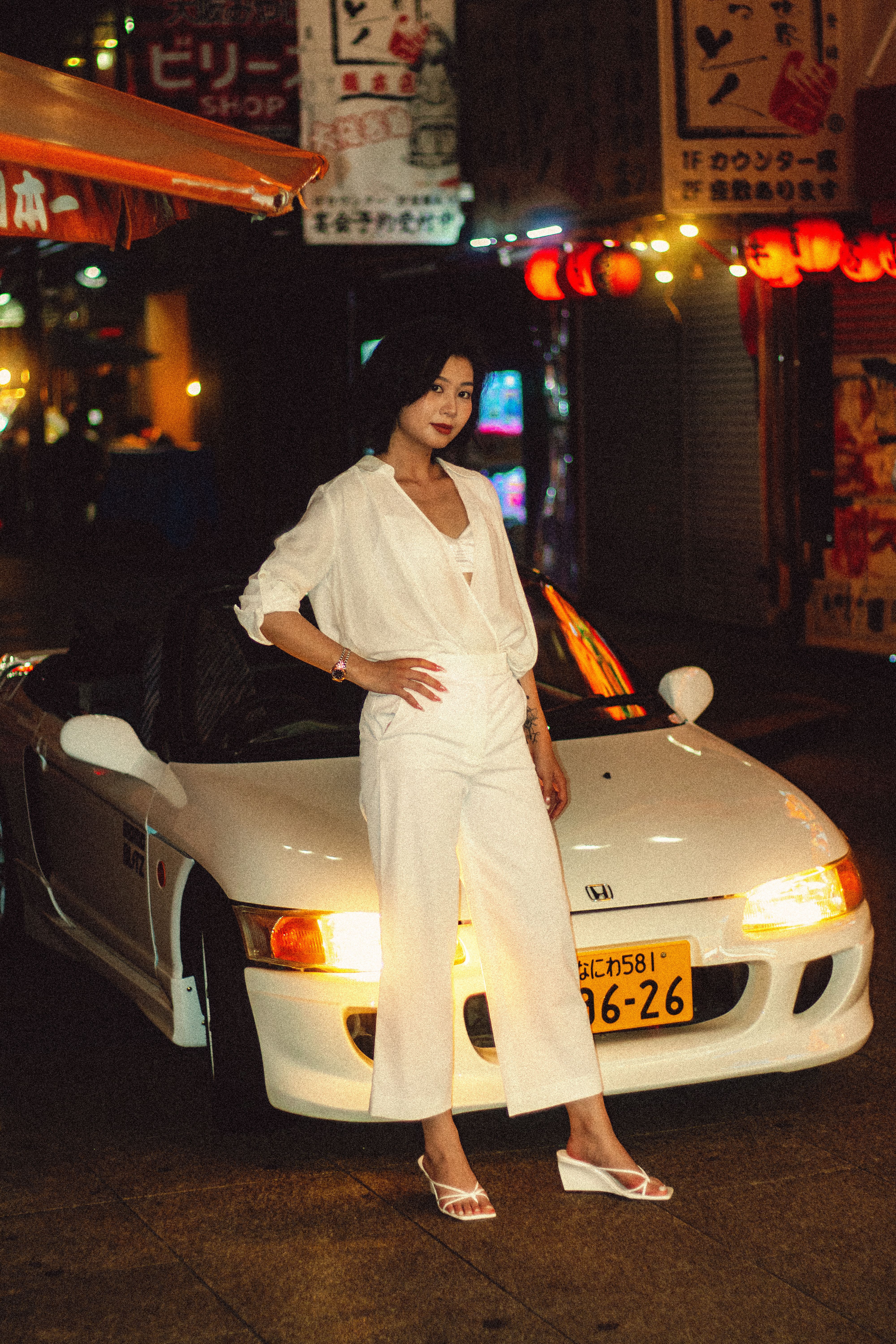 Stylish Woman Posing by Classic Car at Night · Free Stock Photo