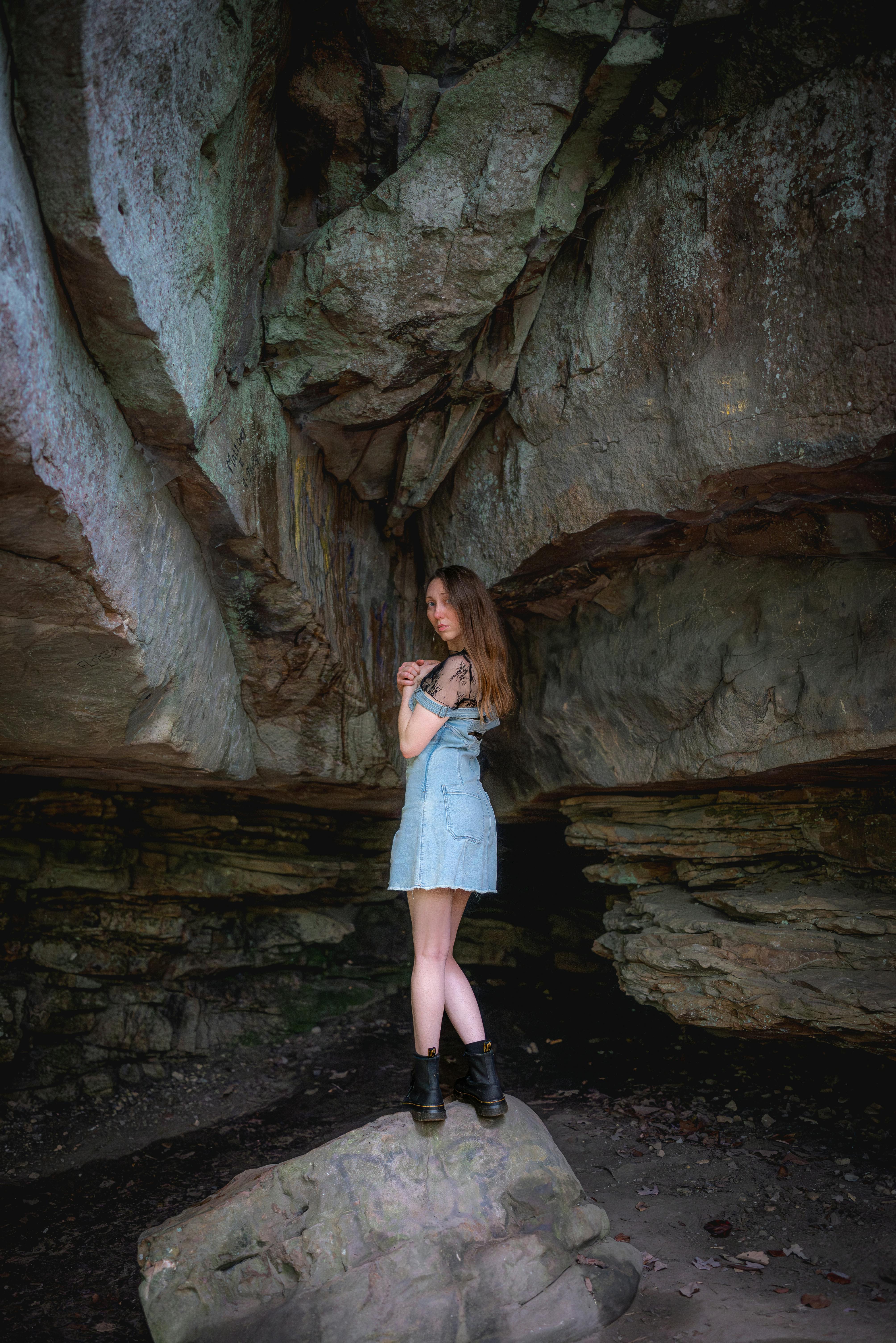 Woman Posing in a Scenic Rocky Cave · Free Stock Photo