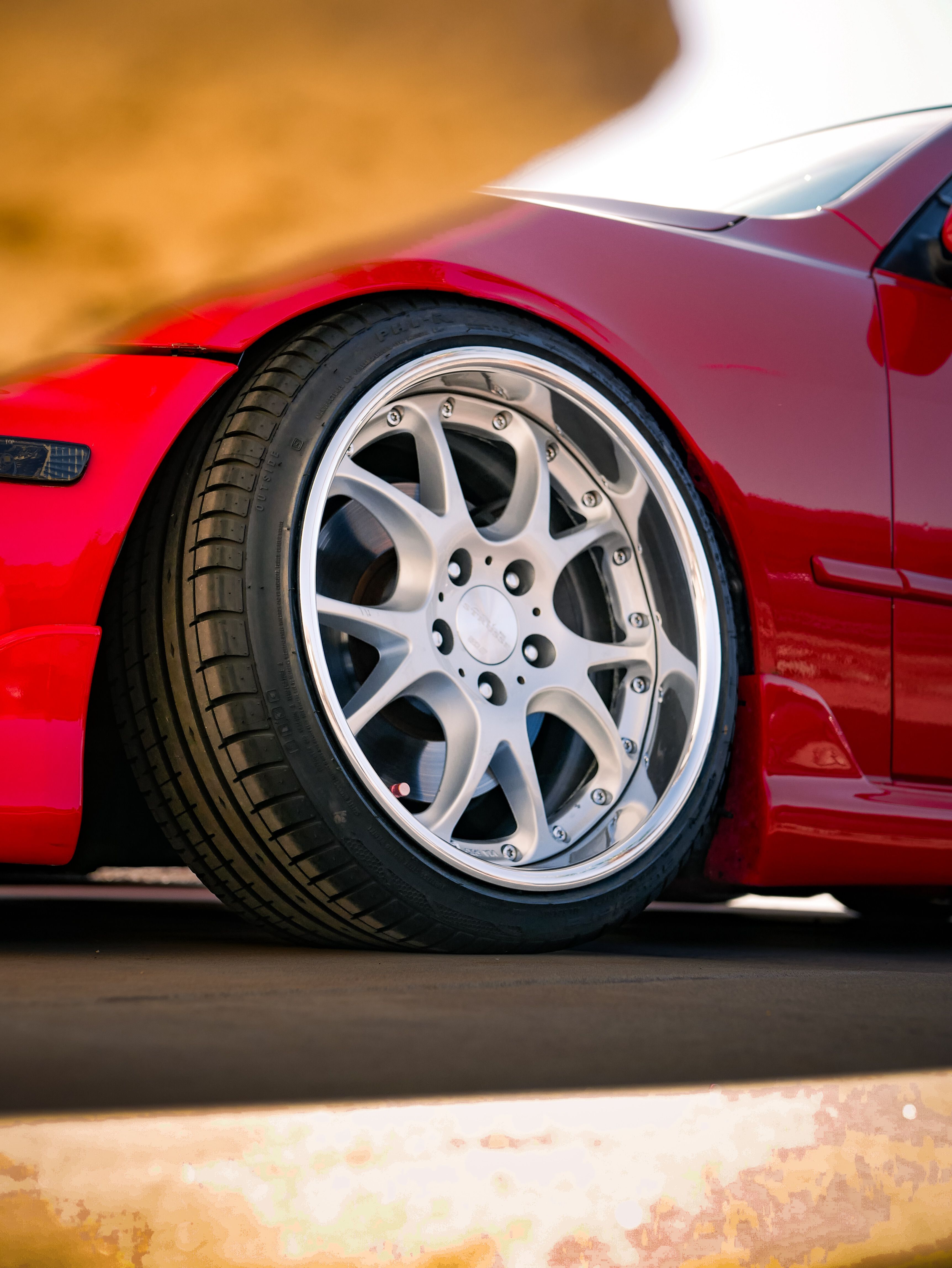 Close-up of Red Sports Car Wheel · Free Stock Photo