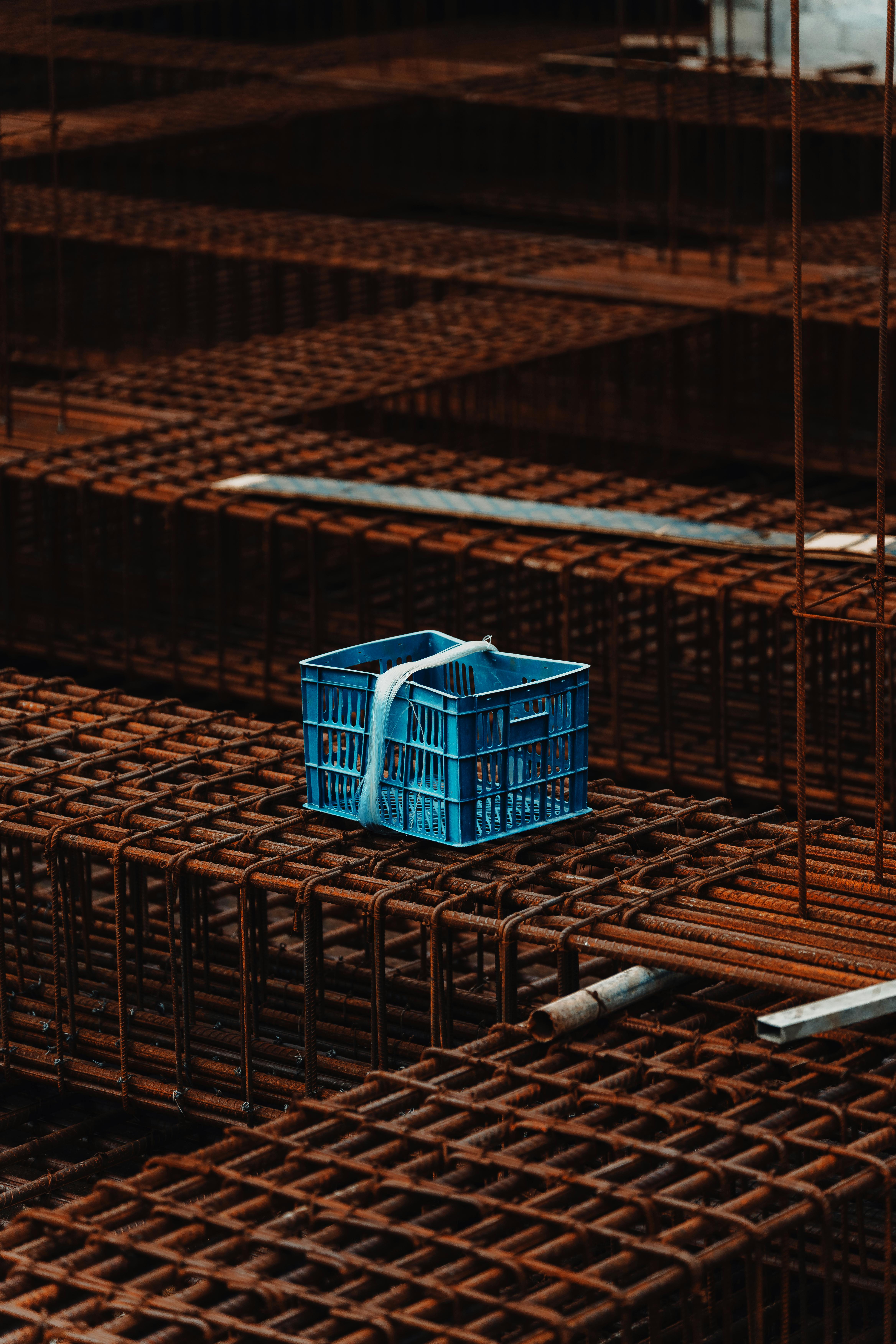 Blue Plastic Crate on Rusty Metal Grid at Construction Site · Free ...