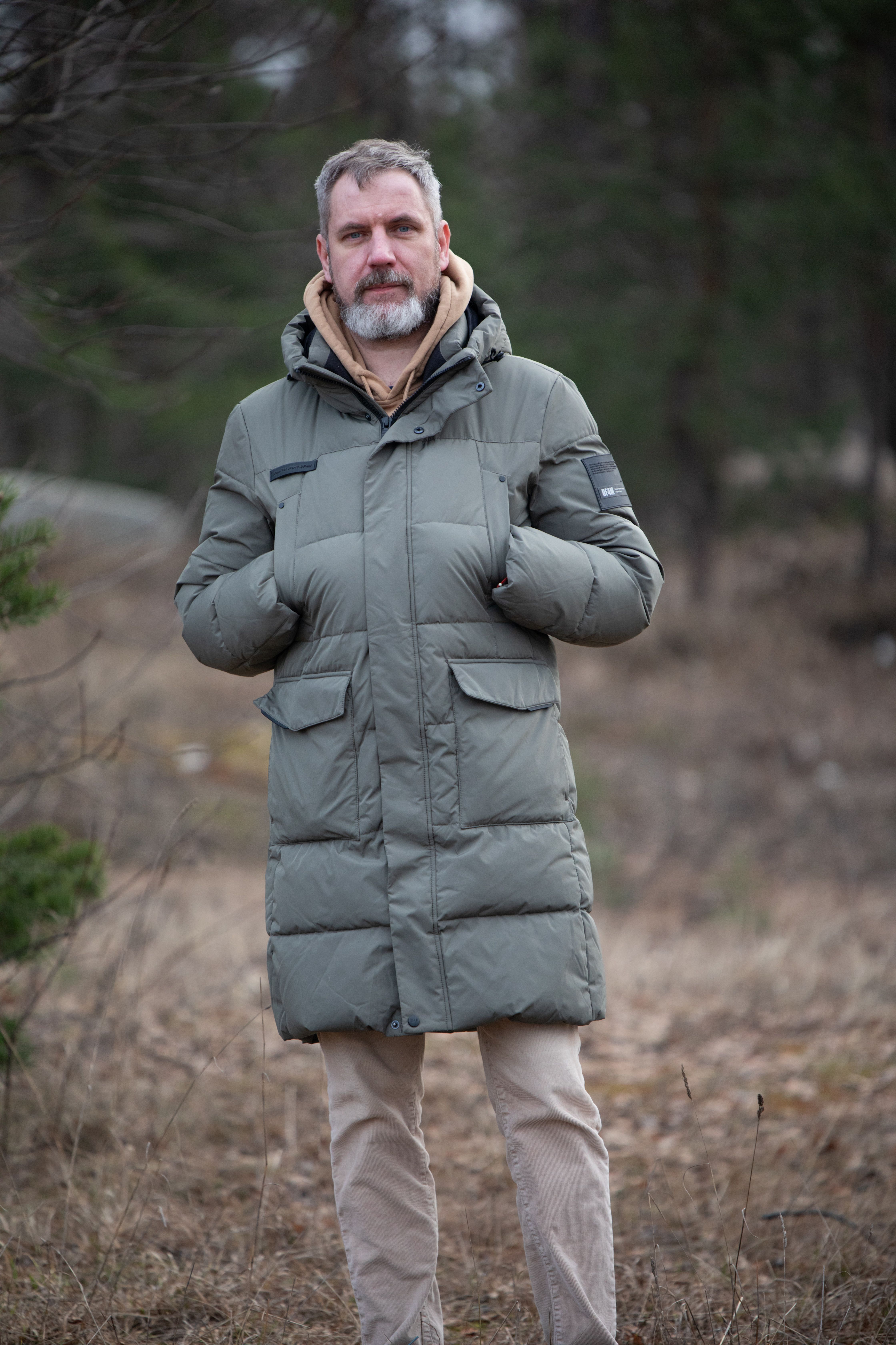 Man in Winter Coat in Forest Setting · Free Stock Photo