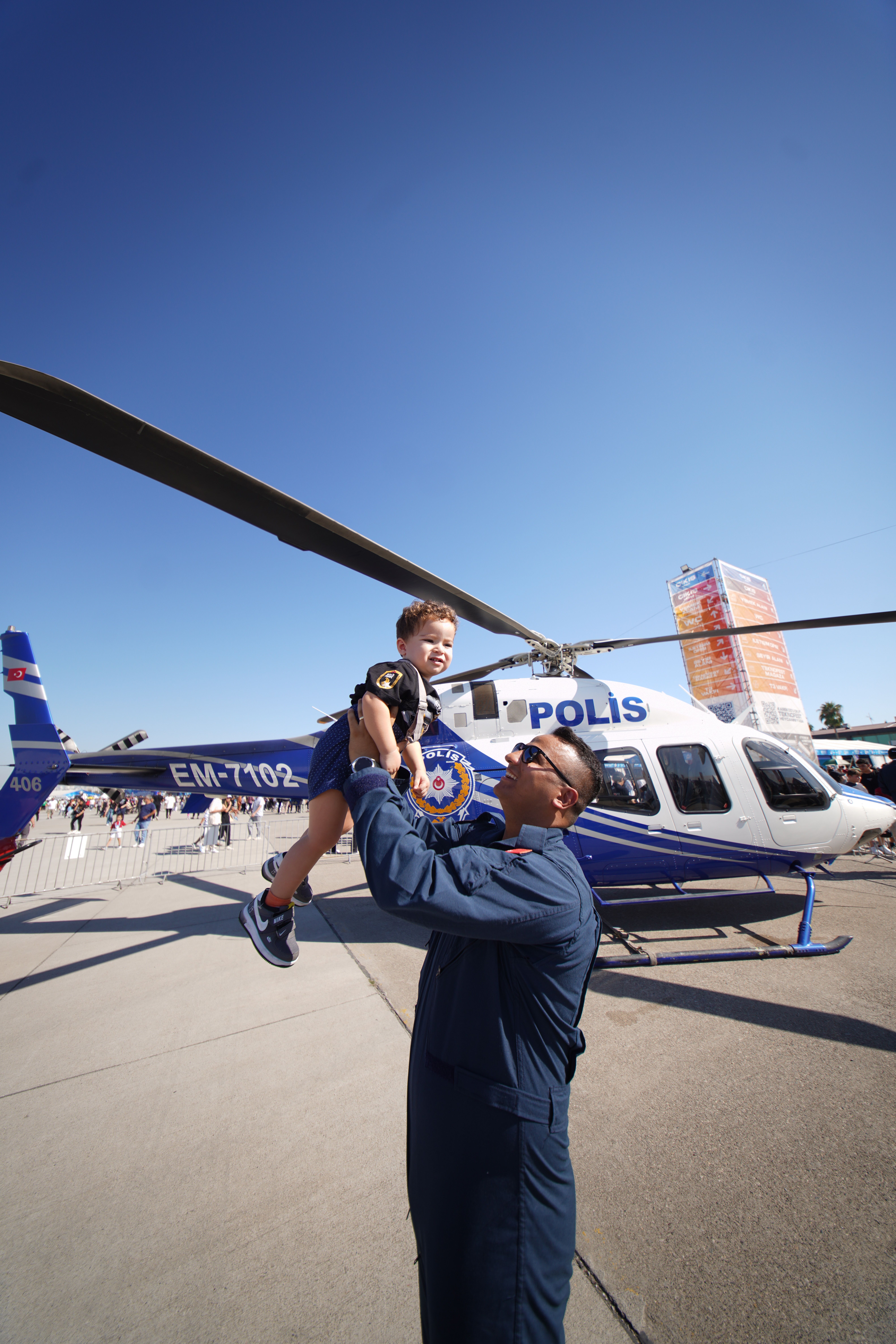 Police Officer Lifts Child by Helicopter at Airshow · Free Stock Photo