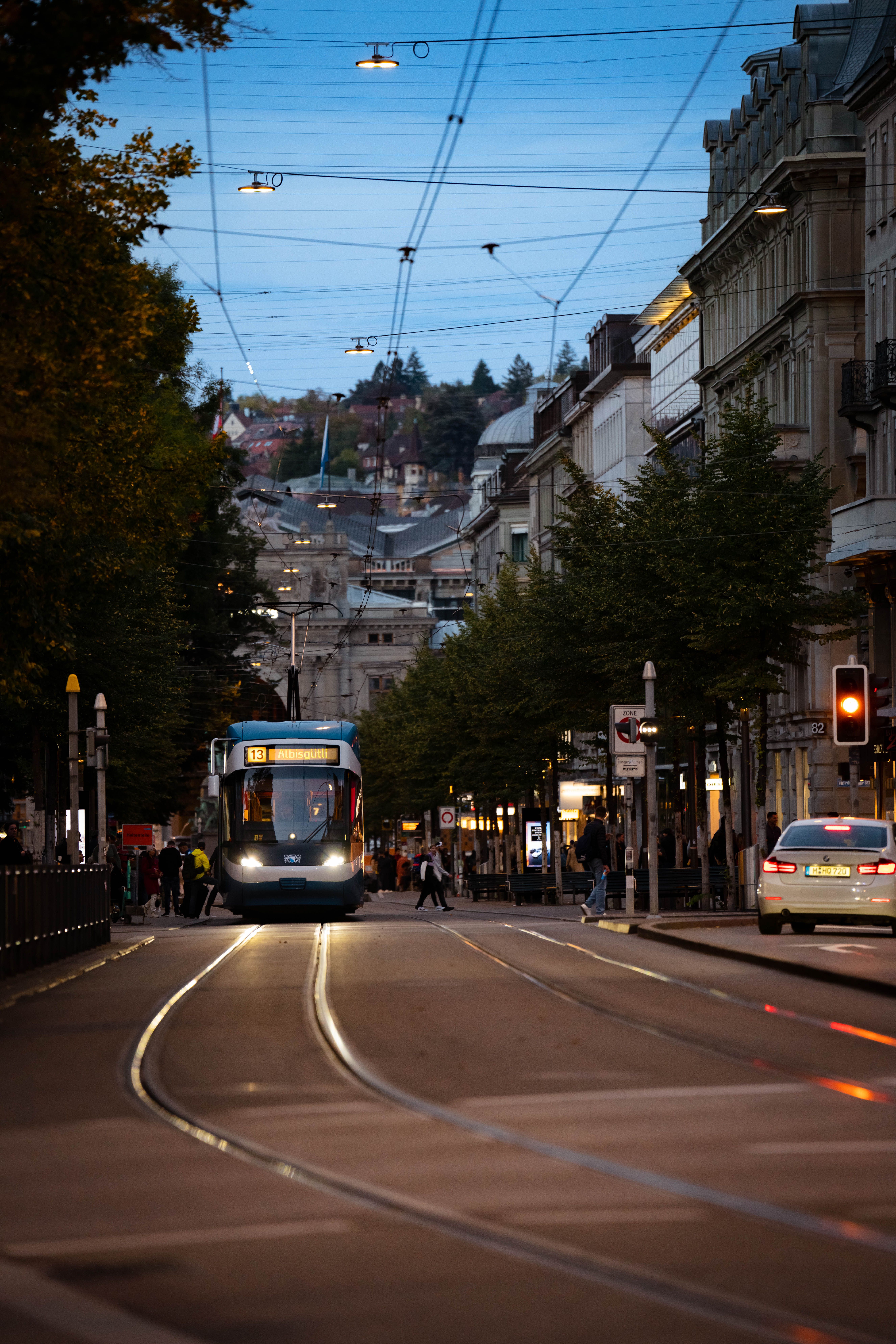 Evening Street View with Tram in Bustling City · Free Stock Photo