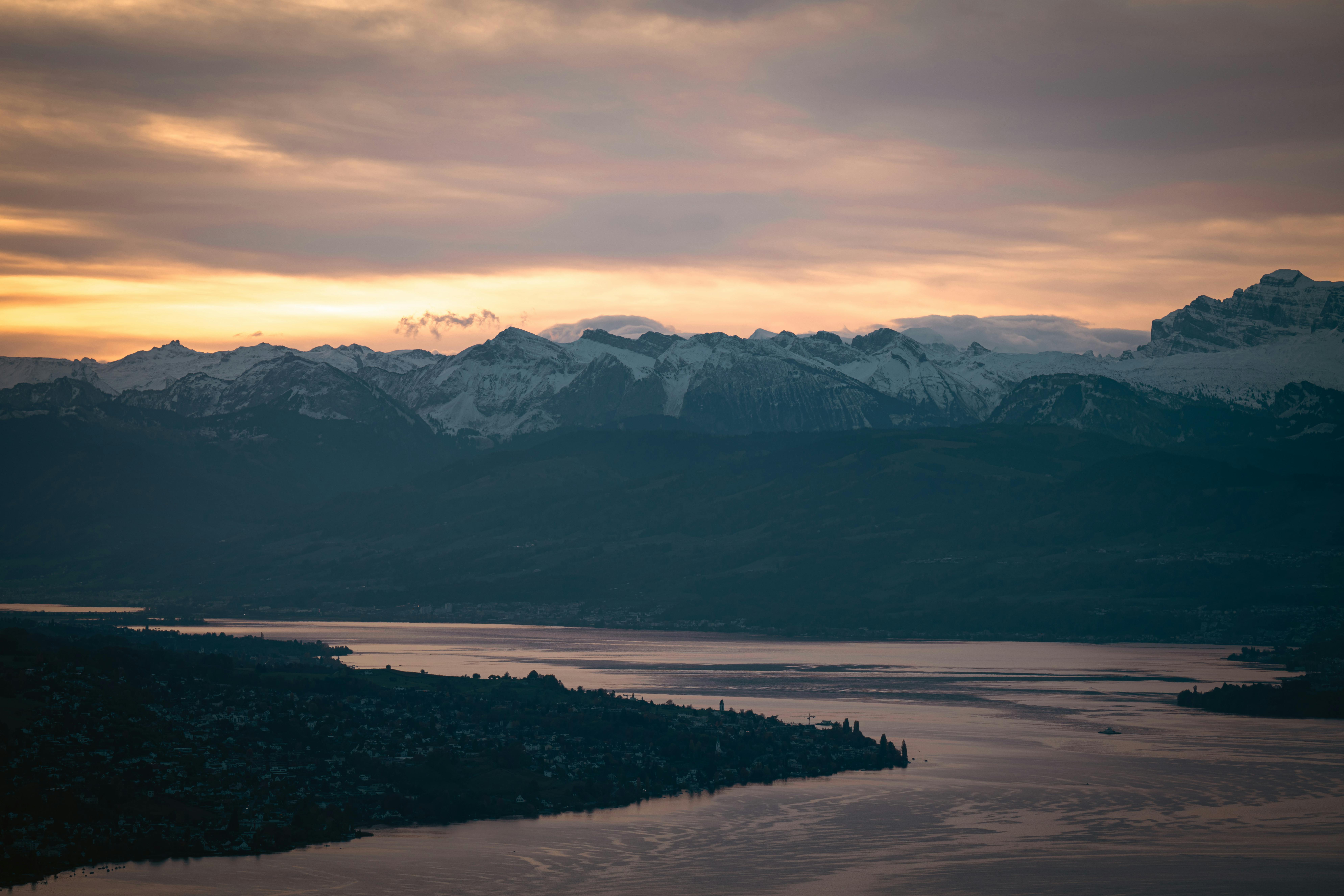 Breathtaking Alpine Sunset Over Tranquil Lake · Free Stock Photo
