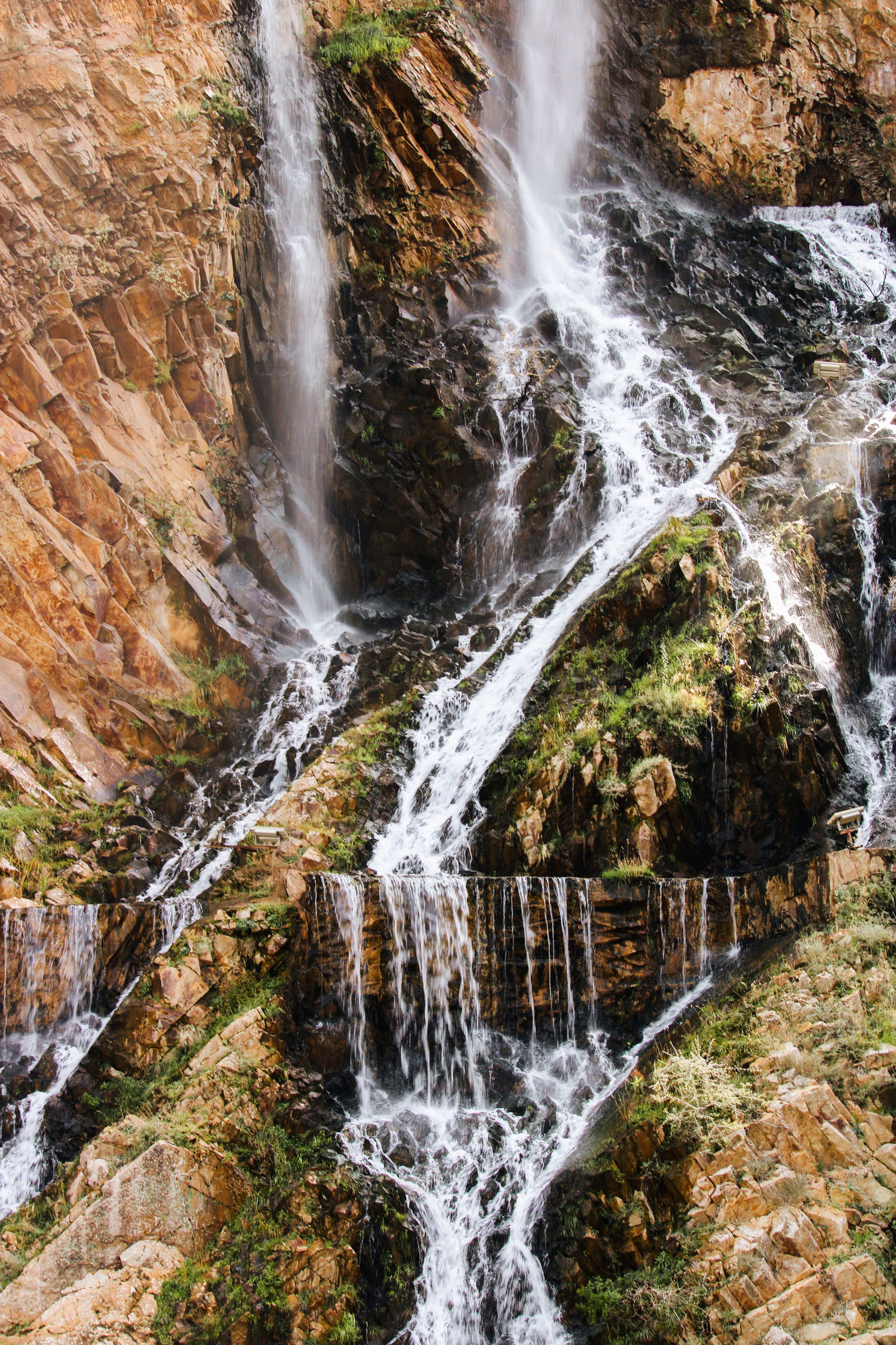 Scenic Mountain Waterfall Cascading Over Rocks · Free Stock Photo