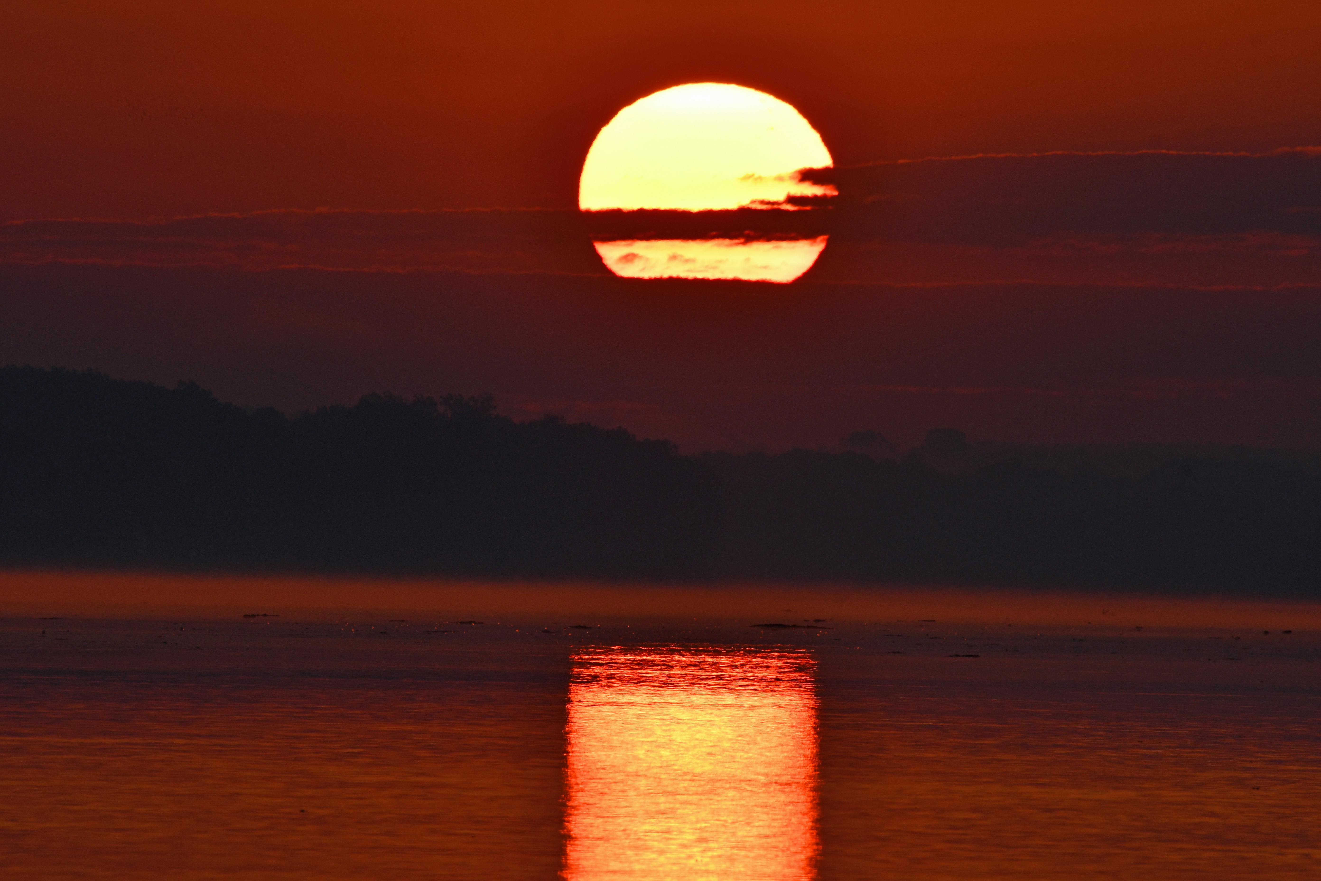 Stunning Sunset with Vibrant Reflection on Water · Free Stock Photo