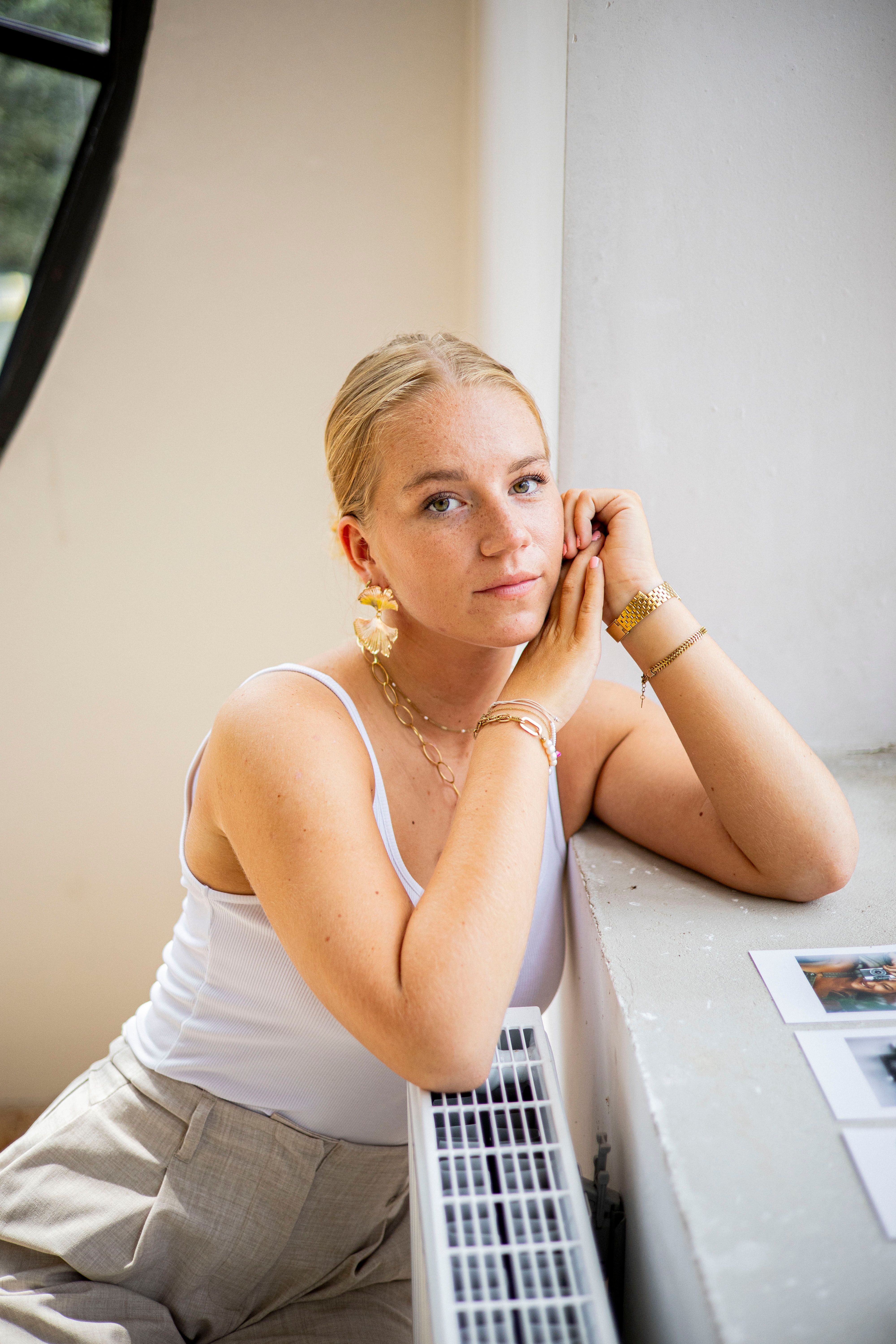 Woman in Relaxed Pose by Bright Window · Free Stock Photo
