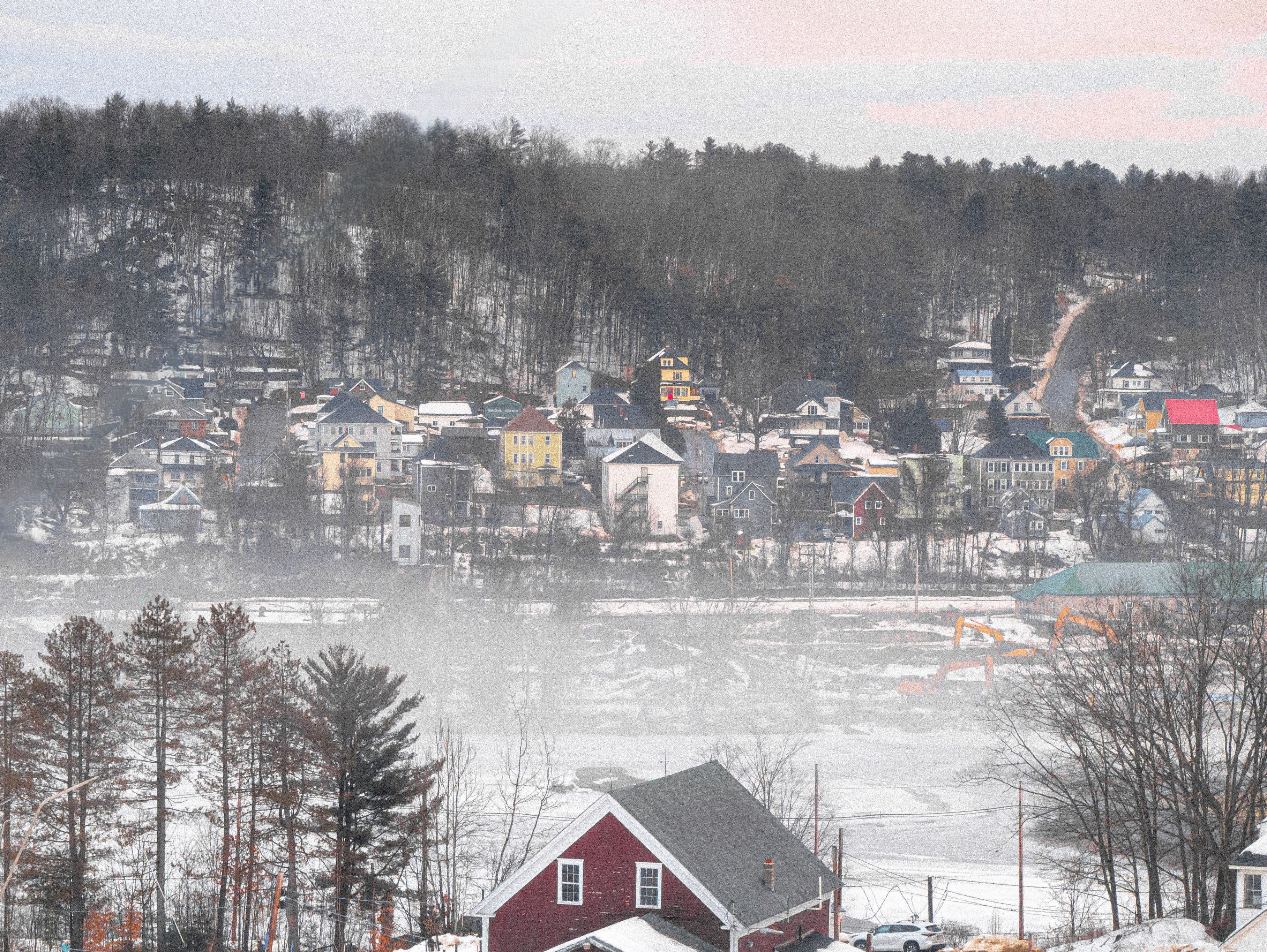 Snowy Riverside Village During Wintertime · Free Stock Photo