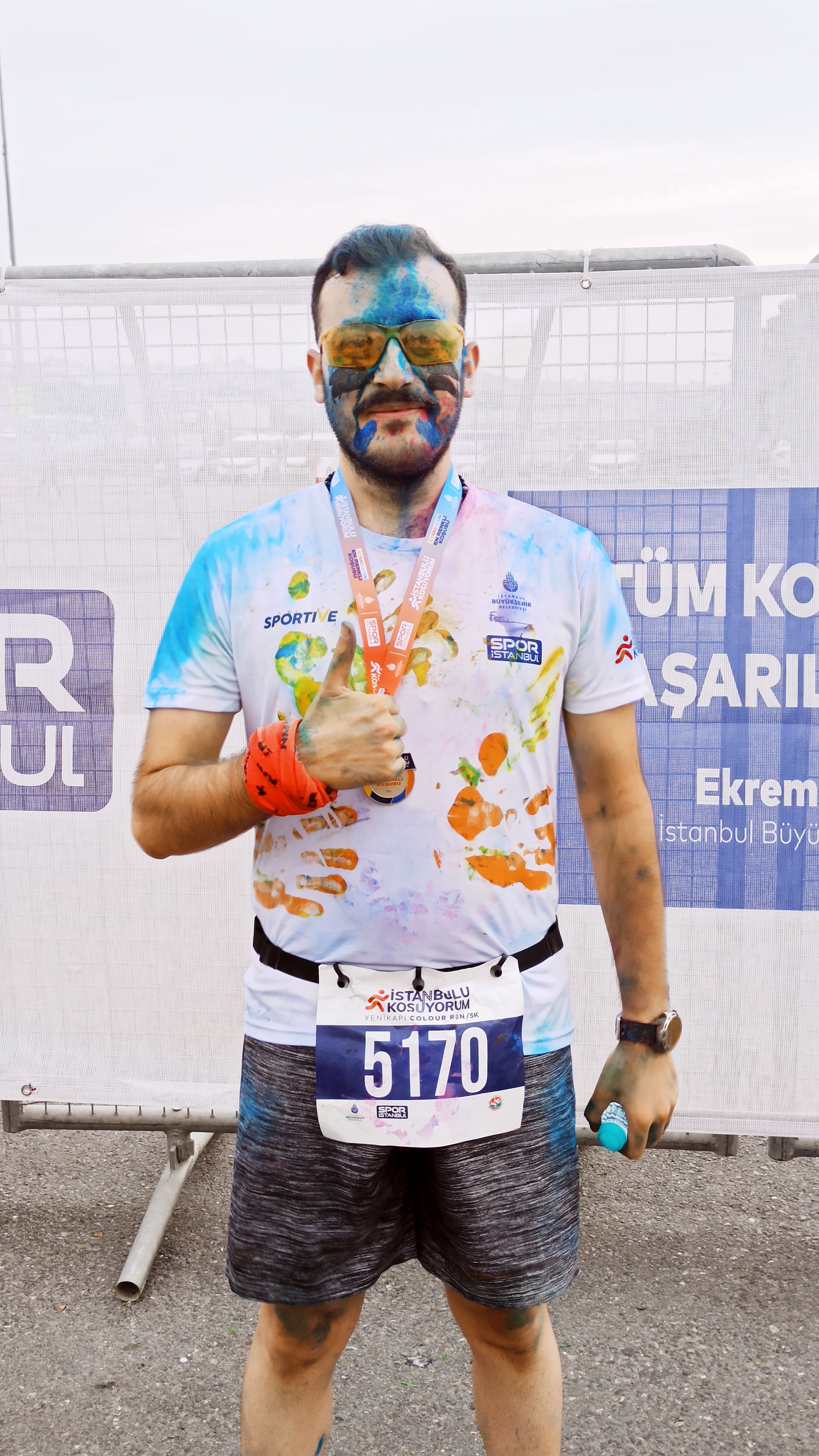 Colorful Fun Run Participant with Medal Post Finish · Free Stock Photo