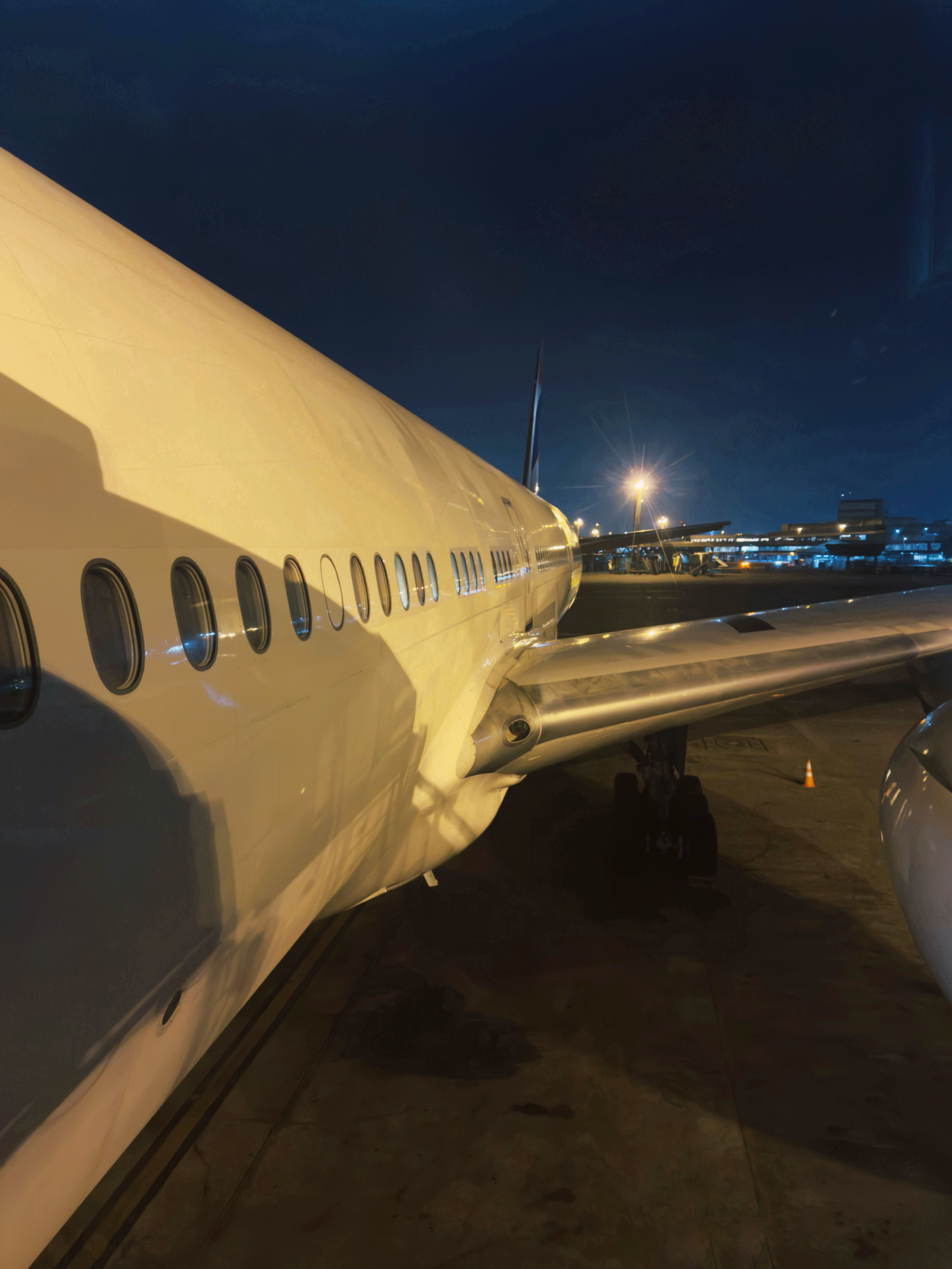 Aircraft Wing at Night Airport Terminal · Free Stock Photo