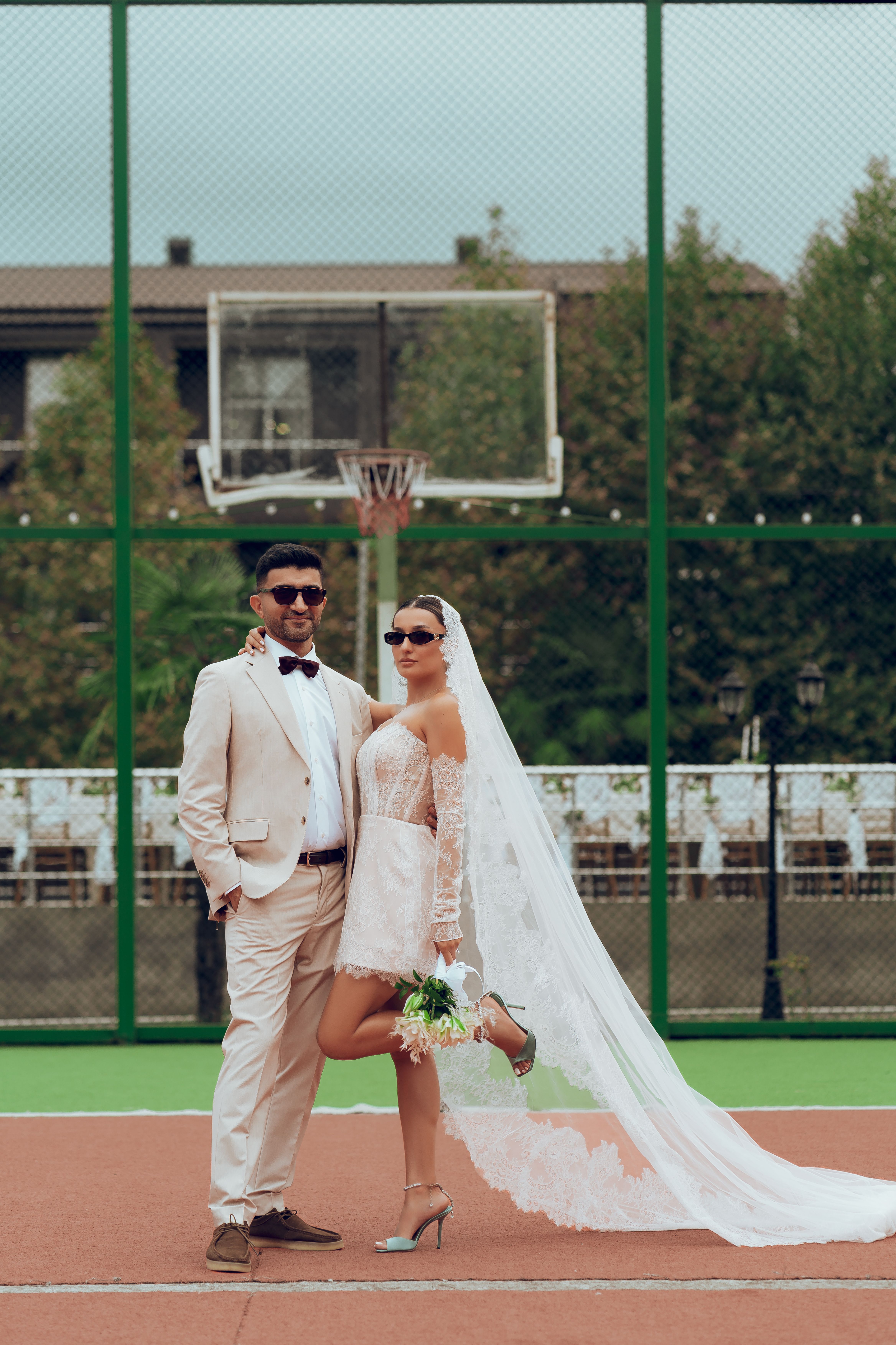 Elegant Couple Posing on Basketball Court Wedding · Free Stock Photo