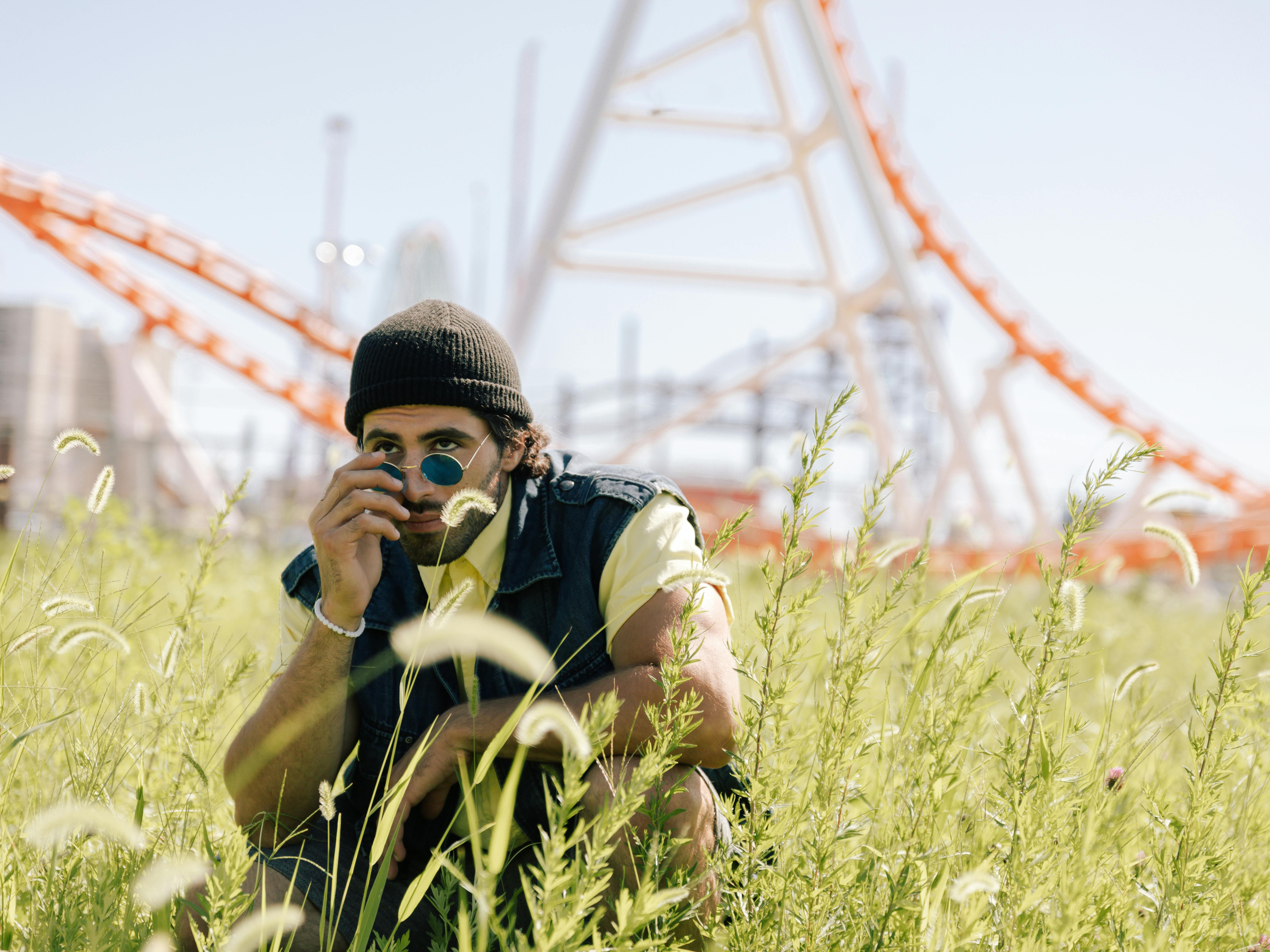Photo of Man Sitting on Chair Posing · Free Stock Photo