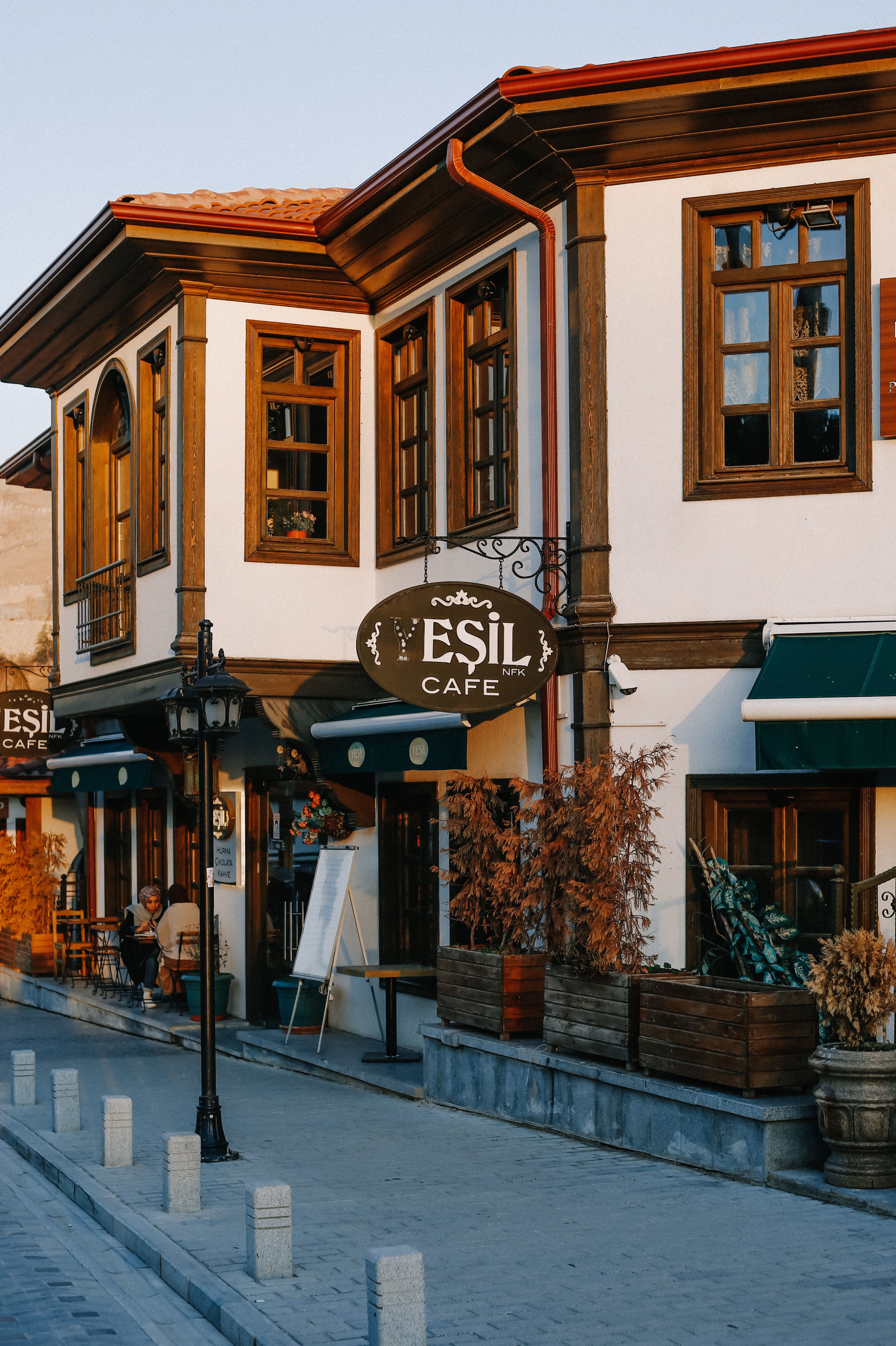 Charming Street Cafe at Sunset with Historic Architecture · Free Stock ...