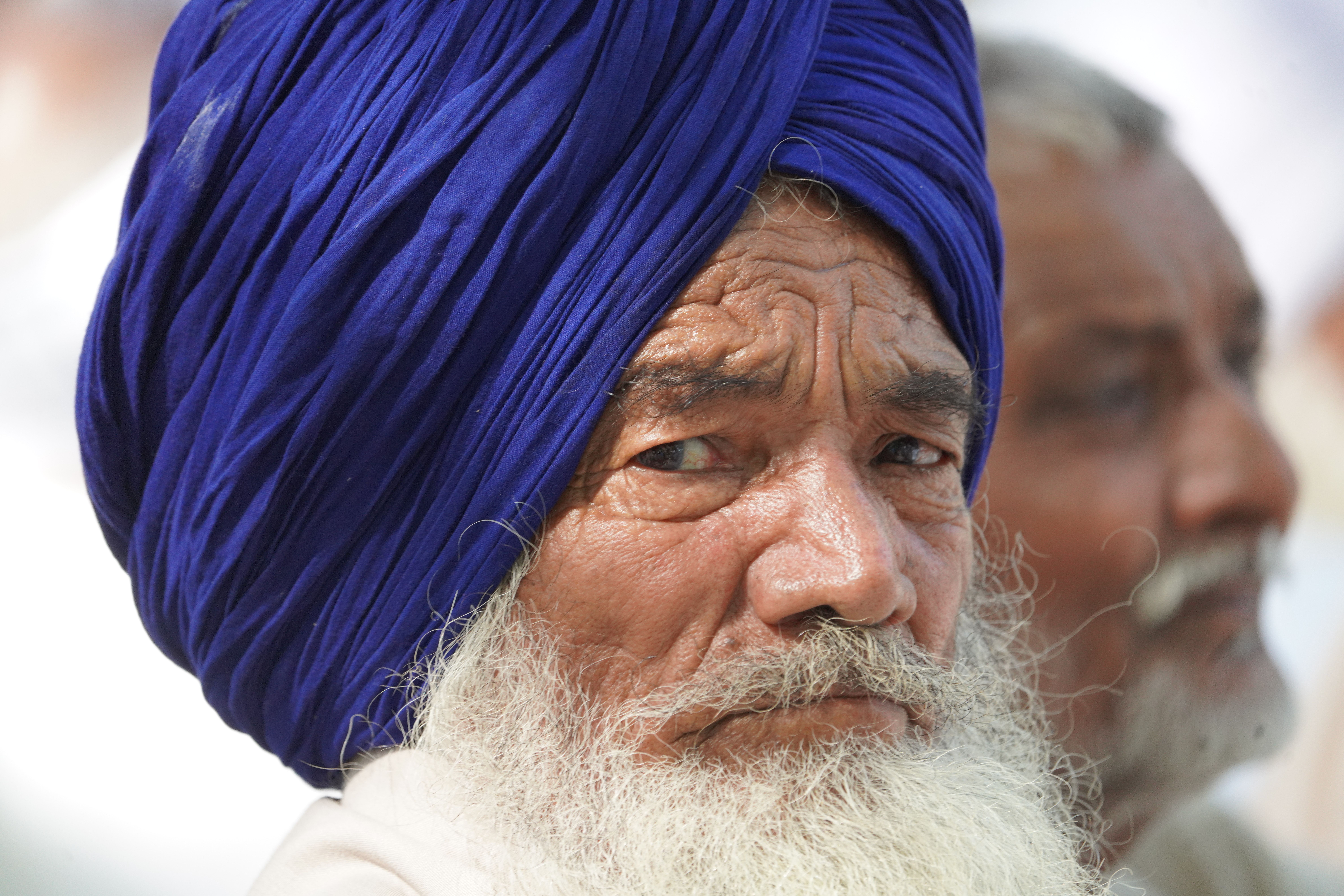 Elderly Sikh Man Wearing a Traditional Blue Turban · Free Stock Photo