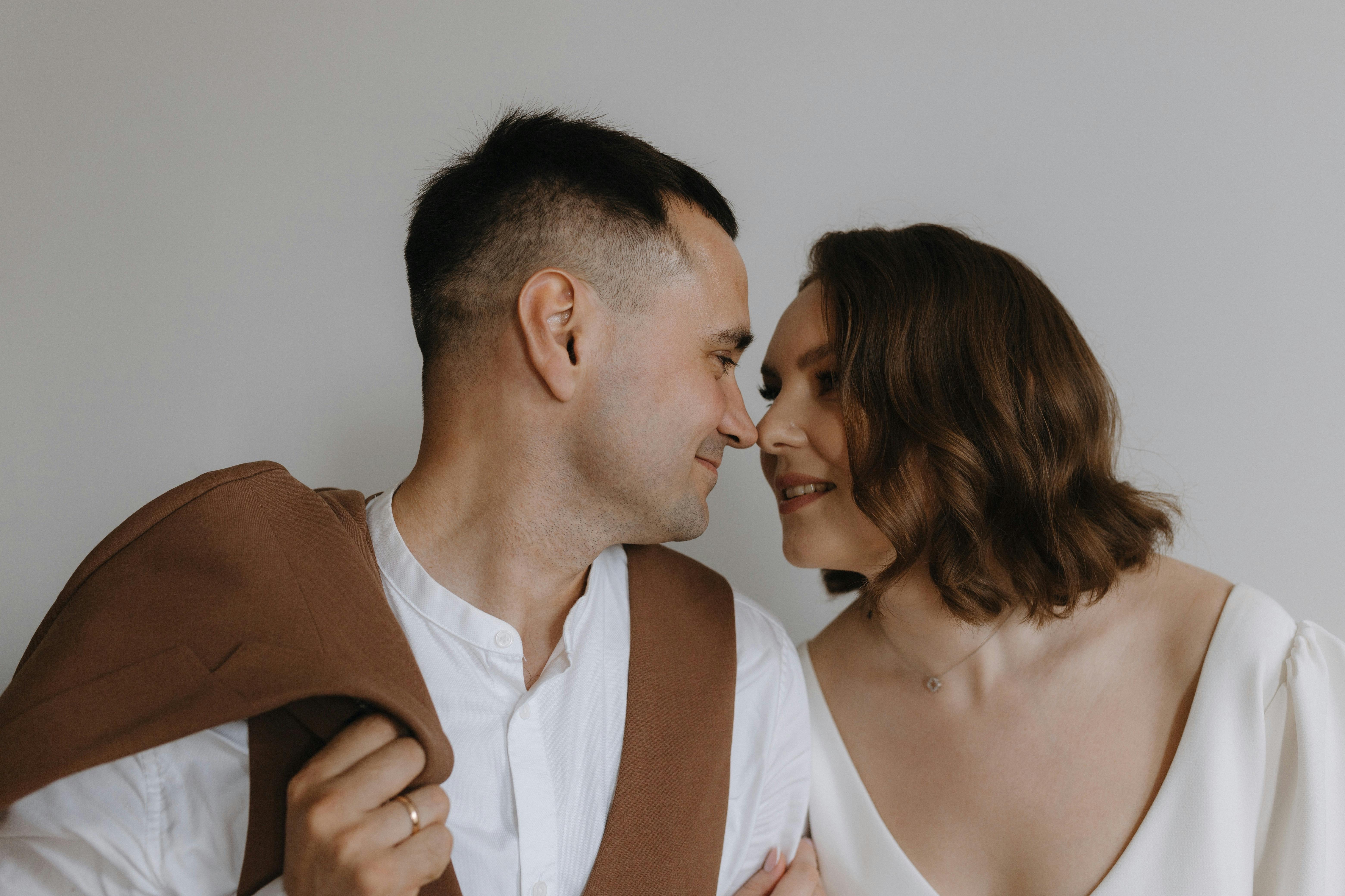 Romantic Couple Gazing Lovingly in Minimalist Setting · Free Stock Photo