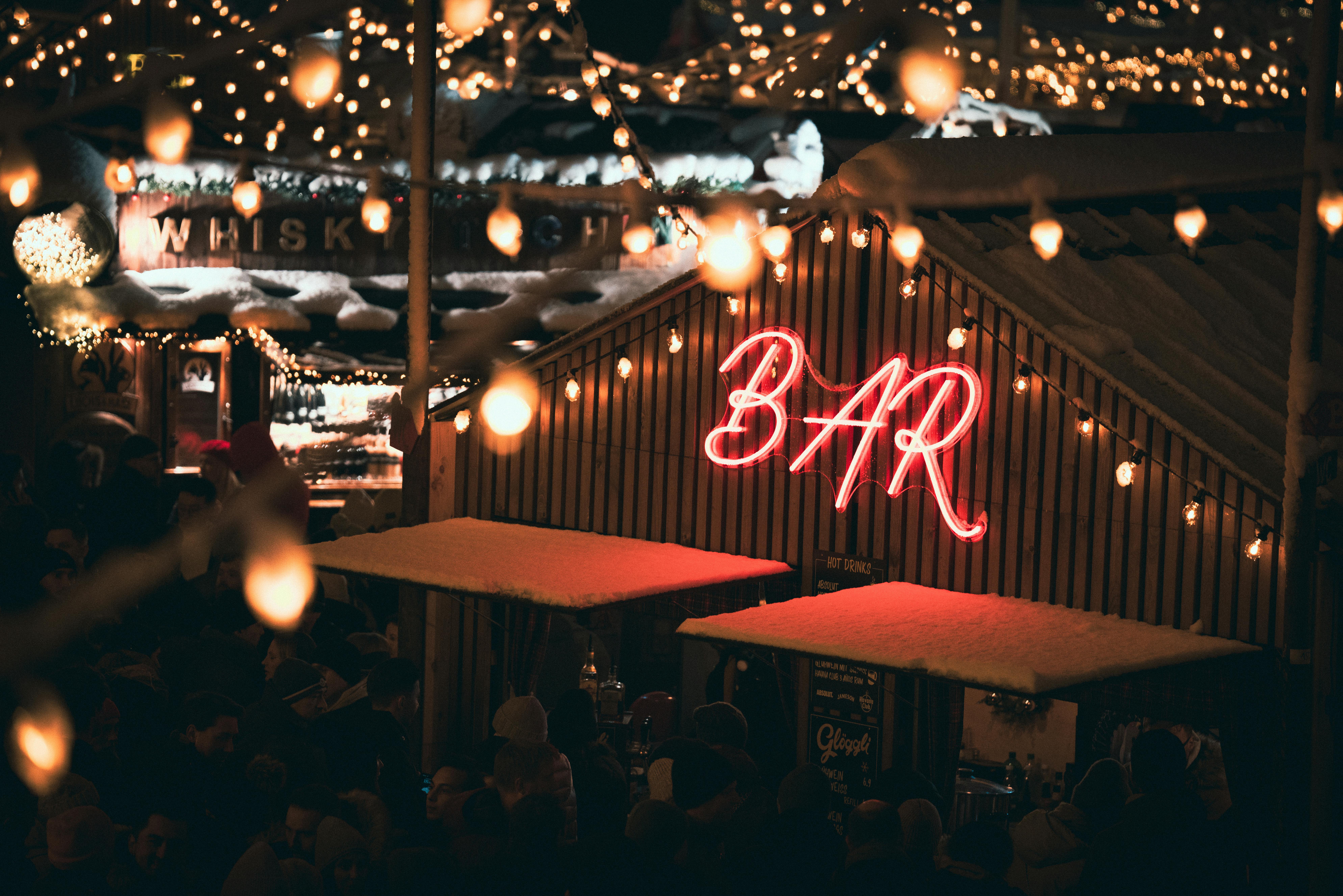 Festive Bar with Neon Lights at Night · Free Stock Photo