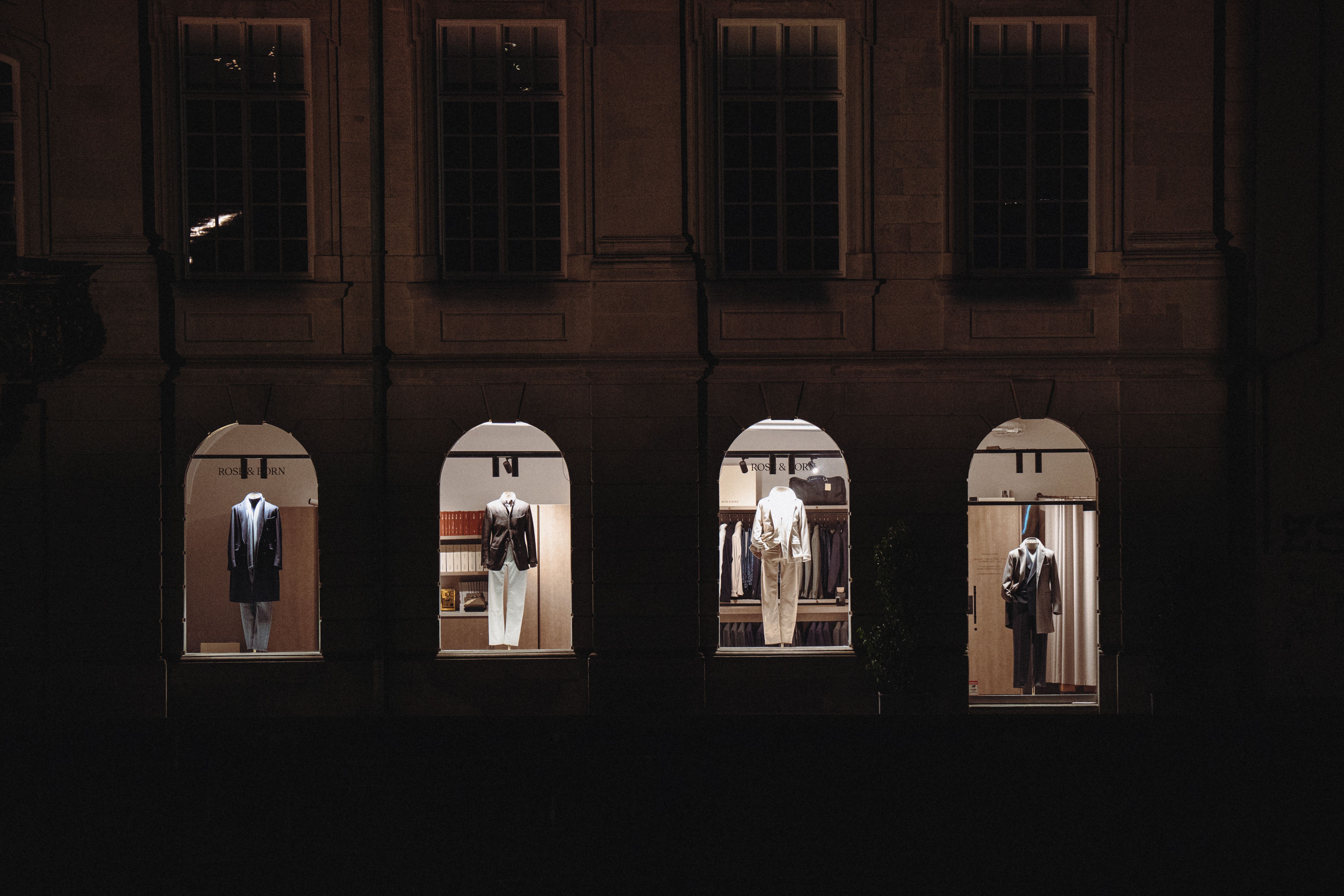 Elegant Fashion Display in Urban Window at Night · Free Stock Photo