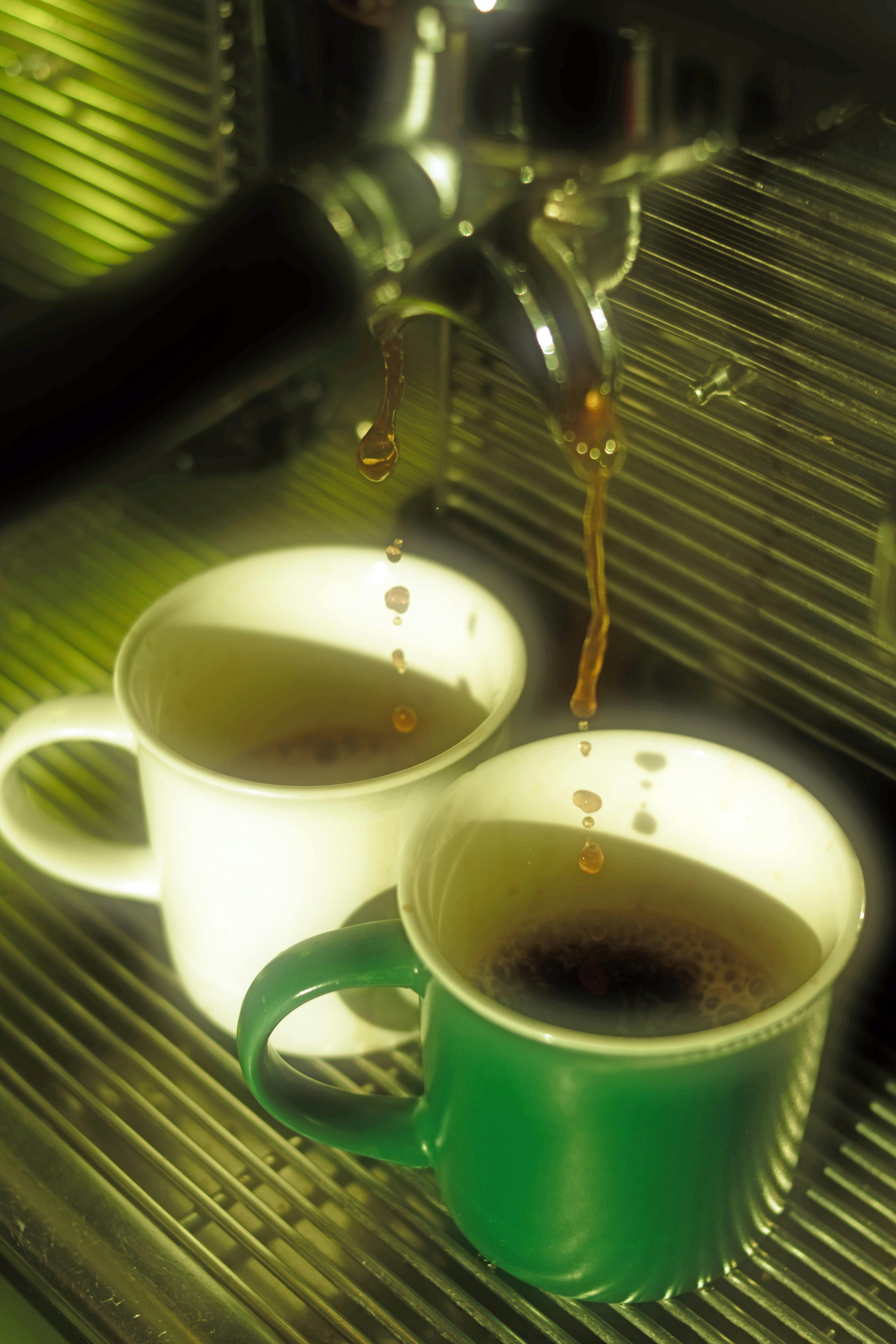 Freshly Brewed Coffee Pouring into Mugs · Free Stock Photo