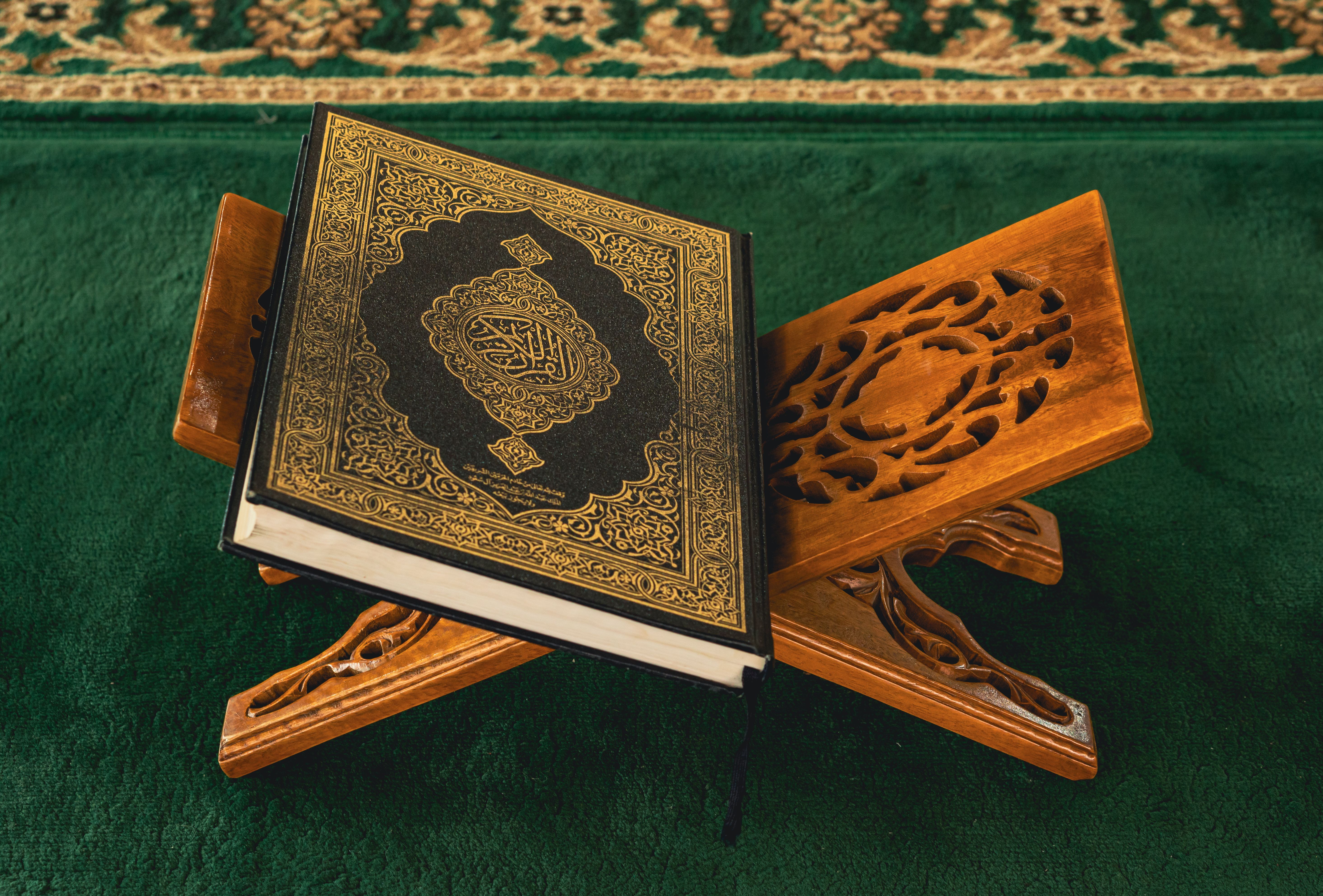 Elegant Quran Displayed on Wooden Rehal · Free Stock Photo
