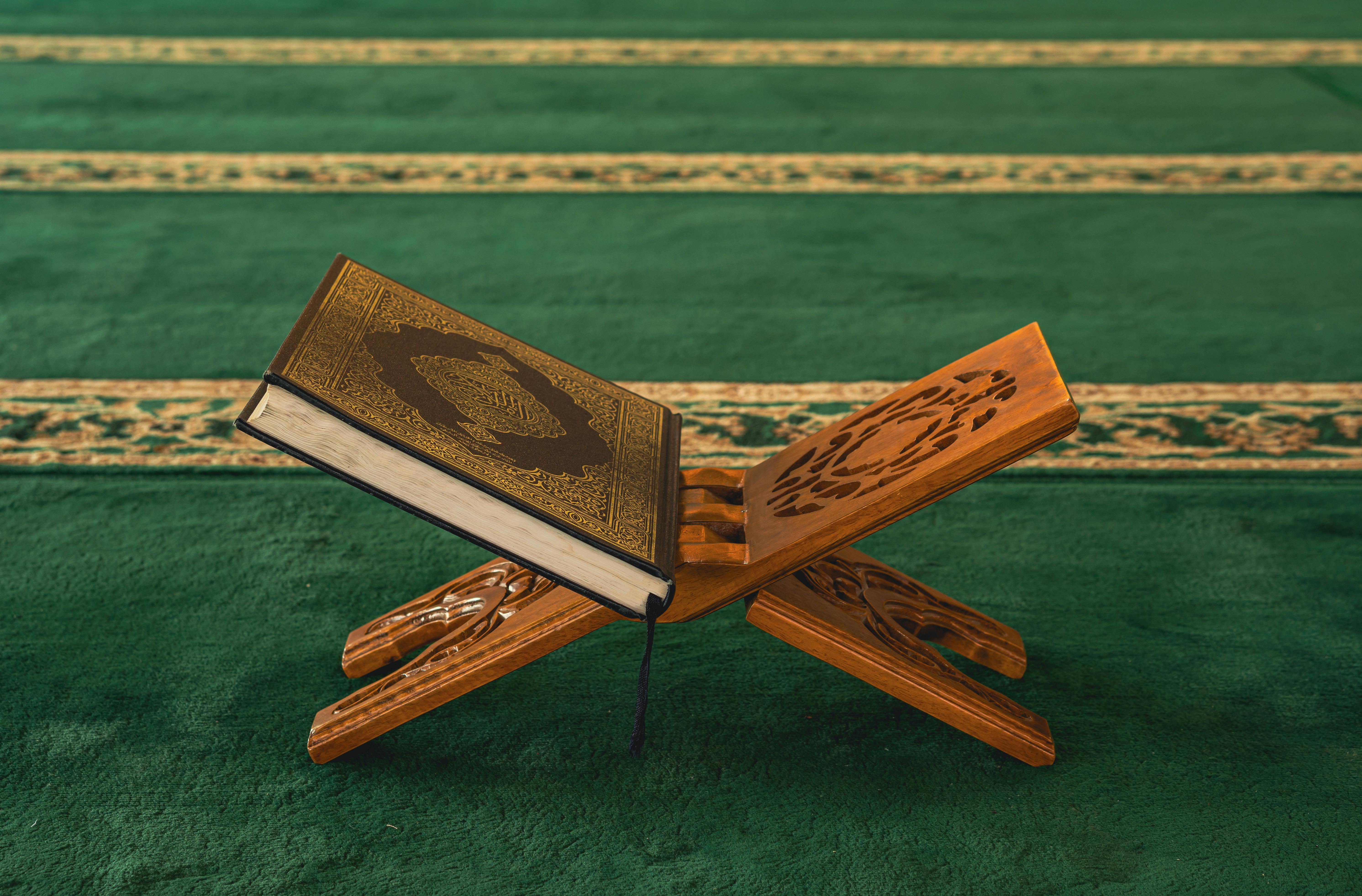 Qur'an on Wooden Stand in a Mosque Interior · Free Stock Photo