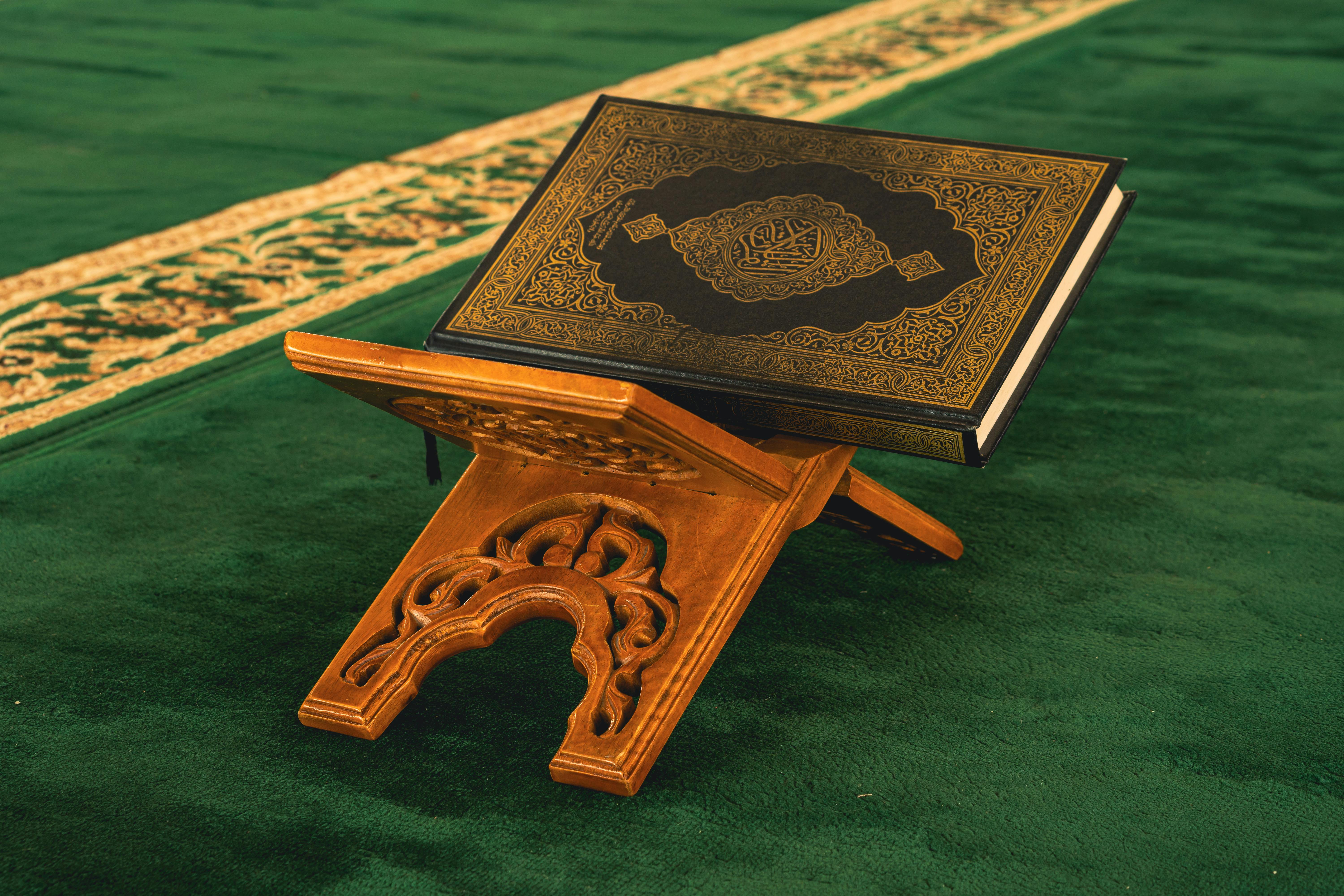 Elegant Quran Resting on Wooden Stand in Mosque · Free Stock Photo
